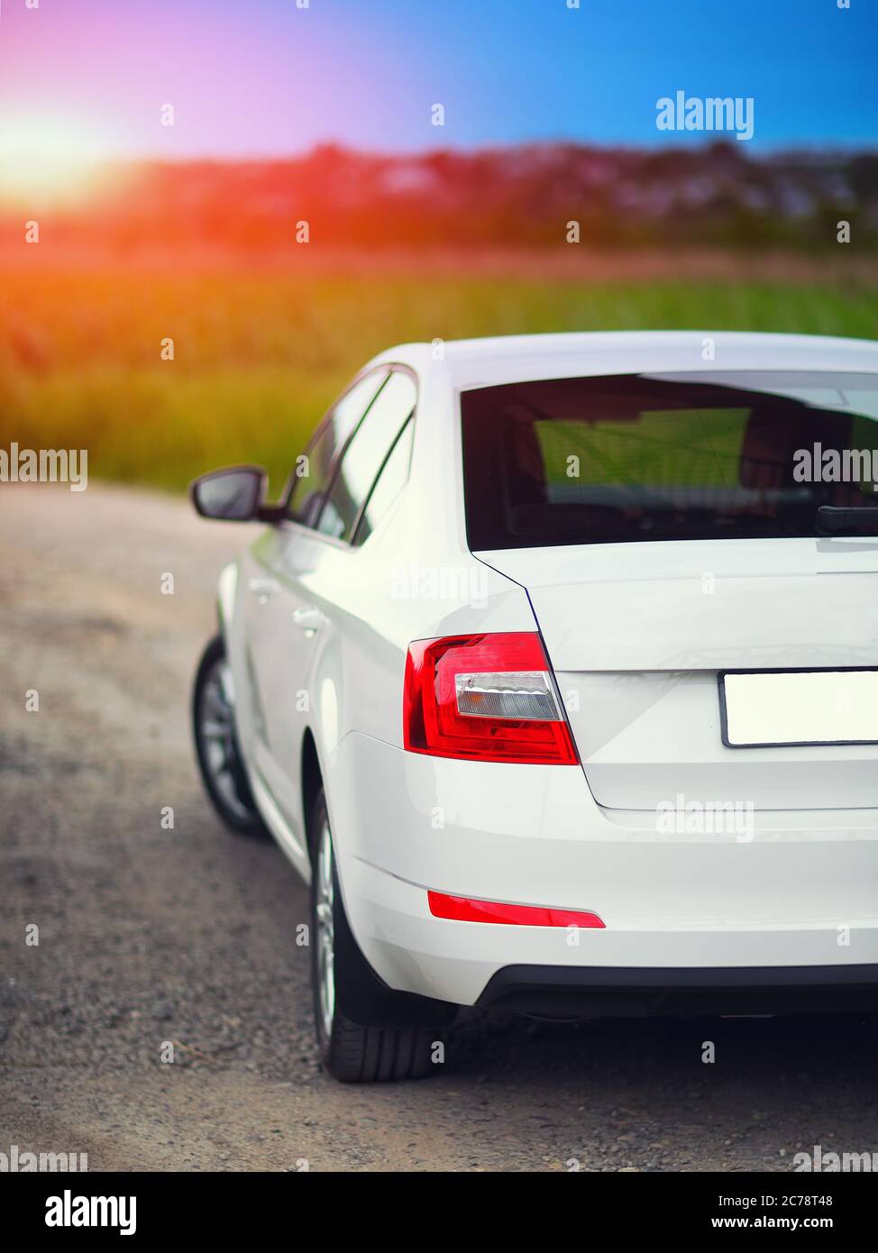 Rear-side view of a car on nature background Stock Photo - Alamy