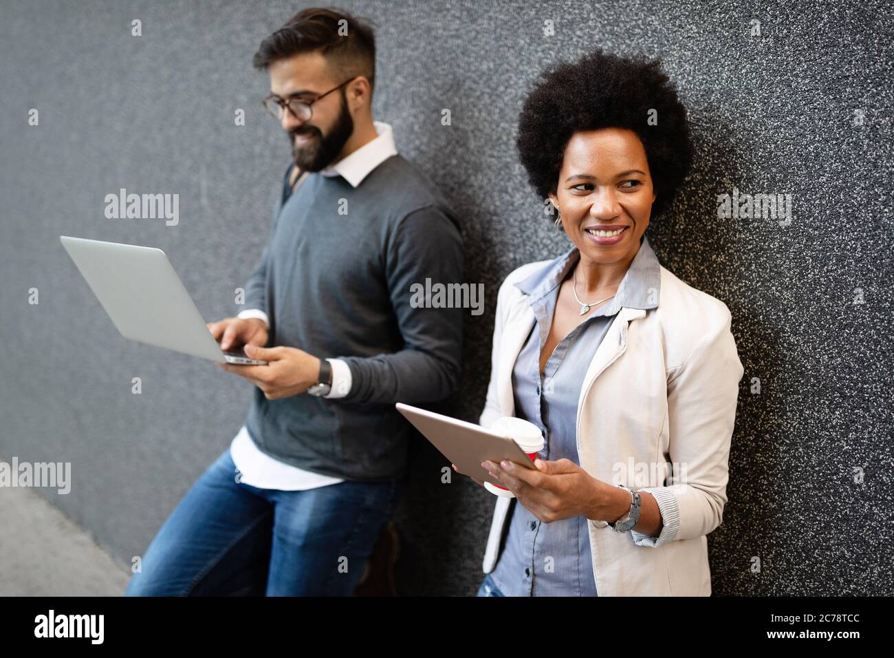 Businesspeople using digital devices hi-res stock photography and ...