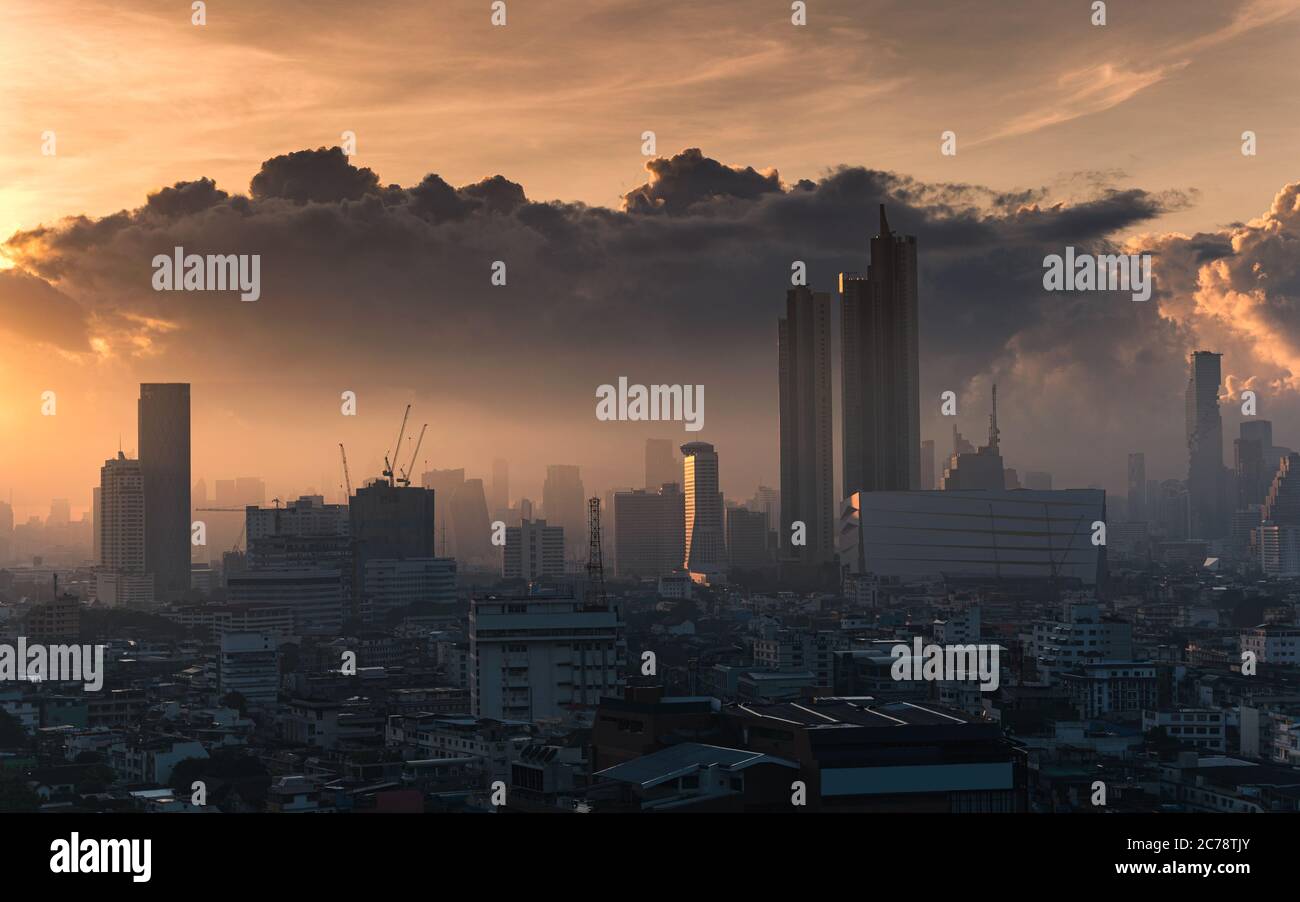 Sunrise over Bangkok city with high buildings in downtown and dramatic ...