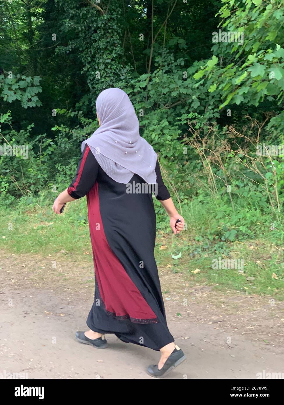 Muslim Woman Walking in Epping Forest Stock Photo - Alamy