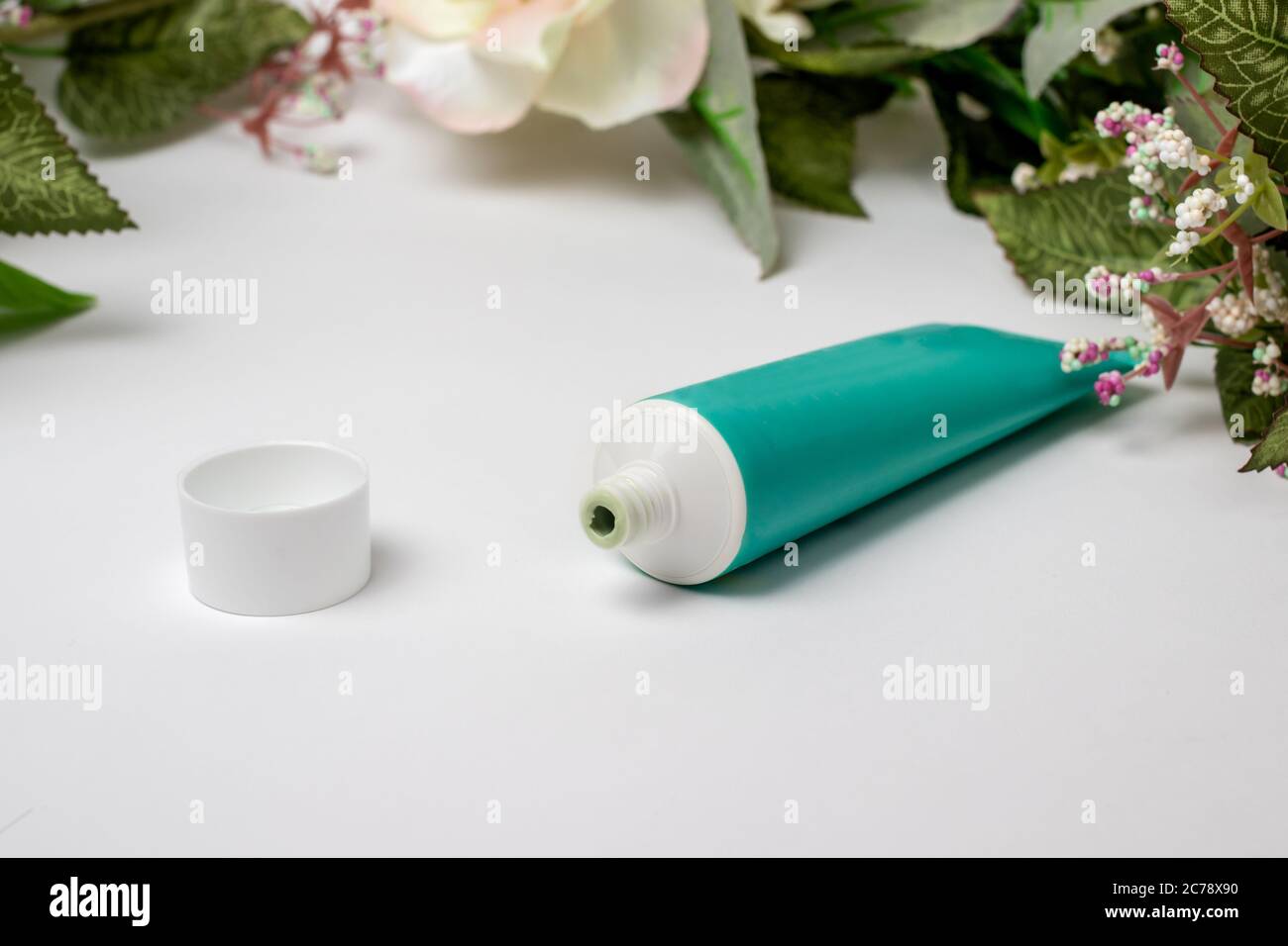 Toothpaste in a plastic tube on a white background. Dental care, tooth ...