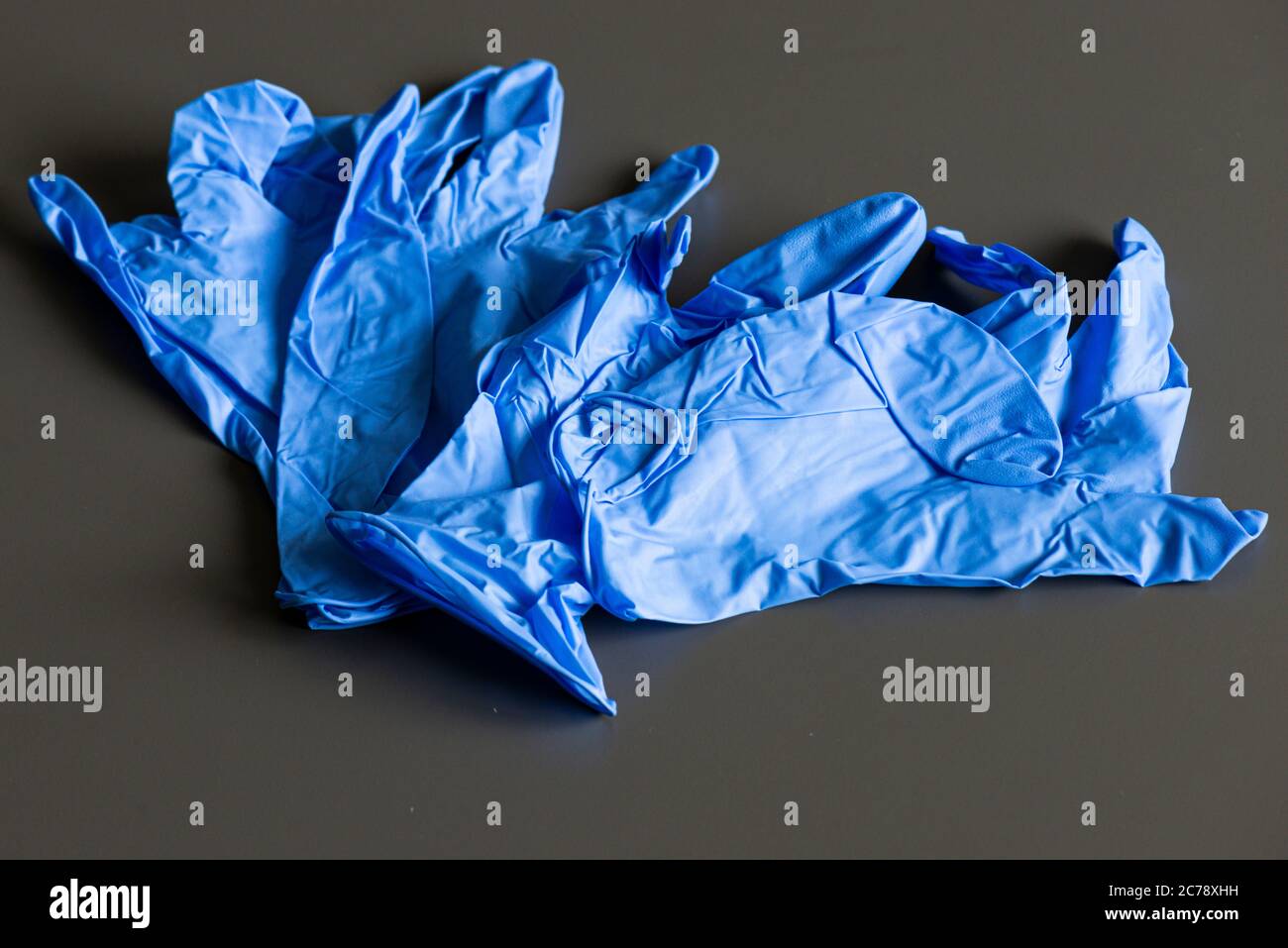 Disposable blue plastic gloves Stock Photo - Alamy