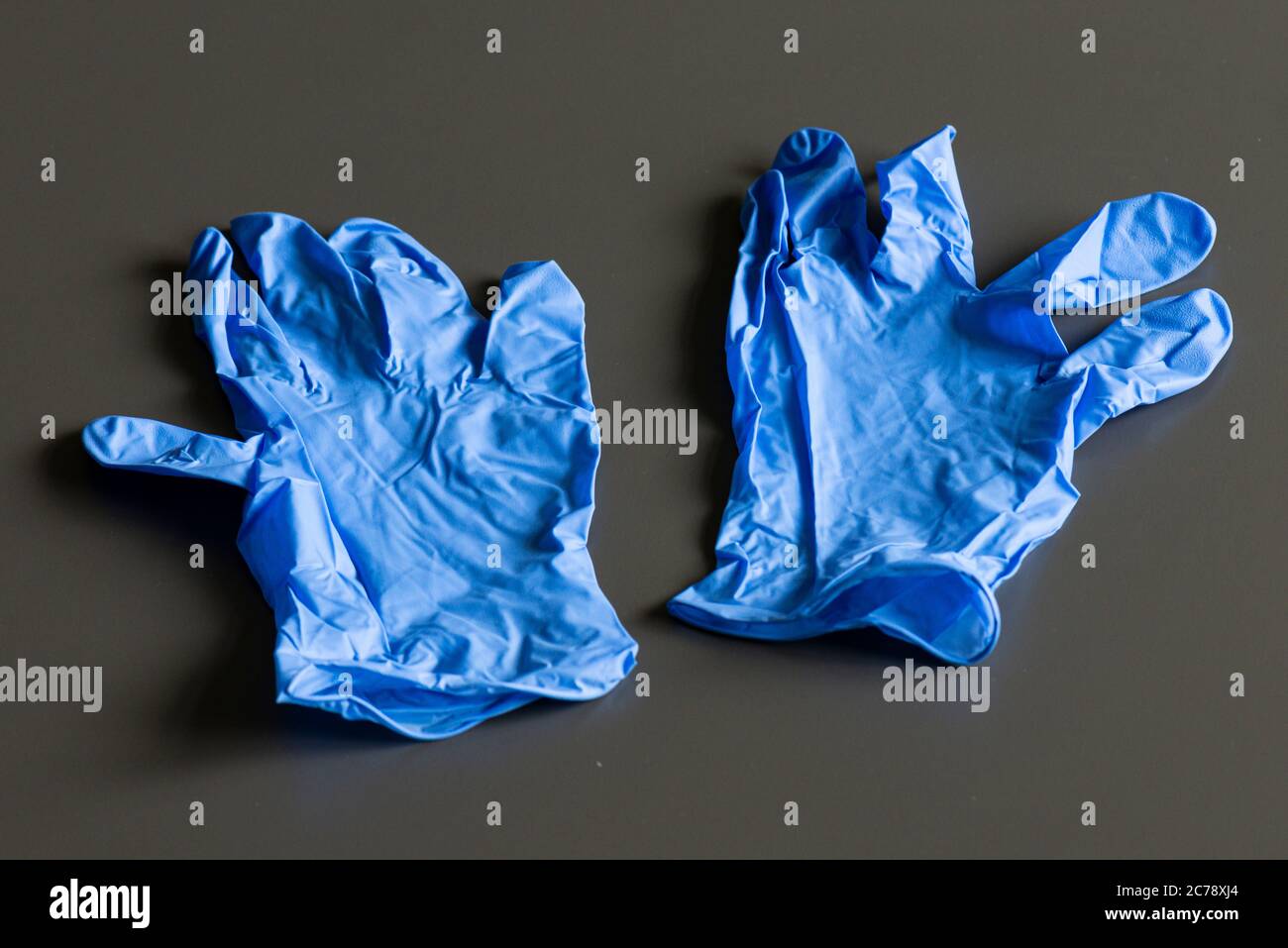 Disposable blue plastic gloves Stock Photo - Alamy