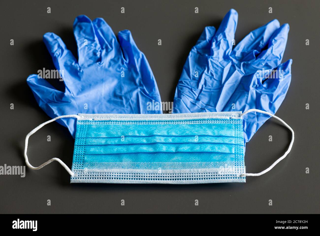 Disposable blue plastic gloves and face mask Stock Photo - Alamy