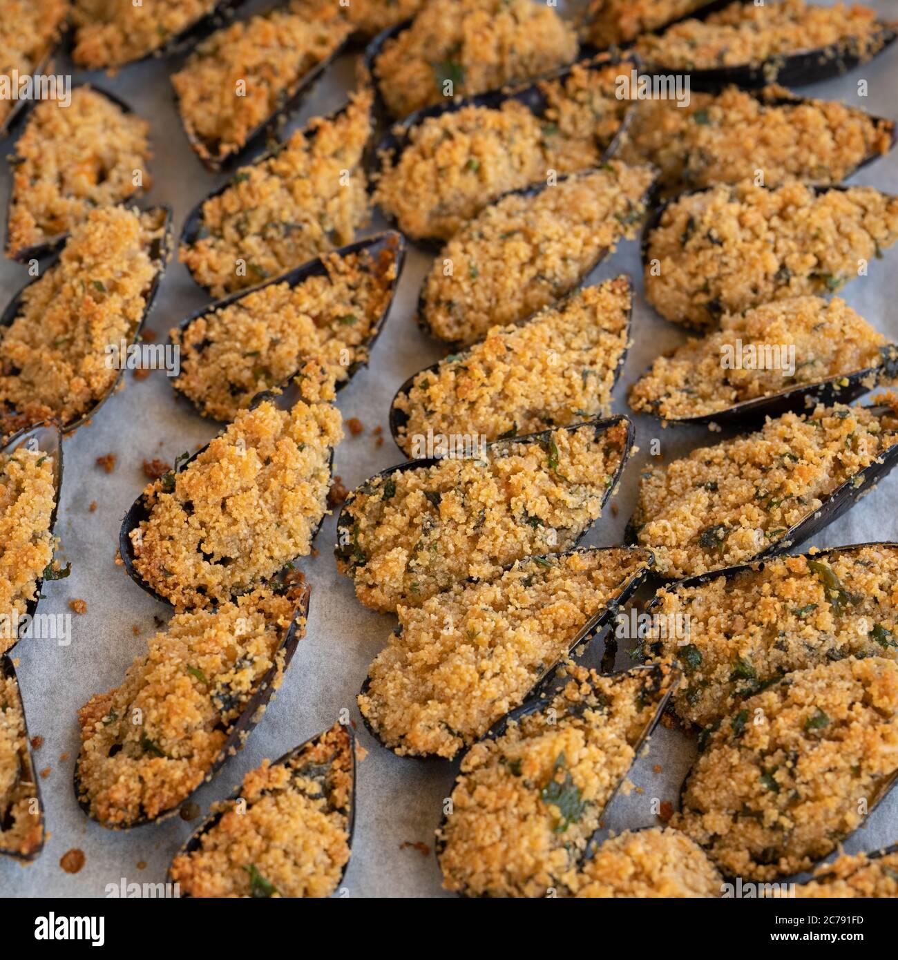 Mussels au Gratin Baked isolated on white background Stock Photo - Alamy
