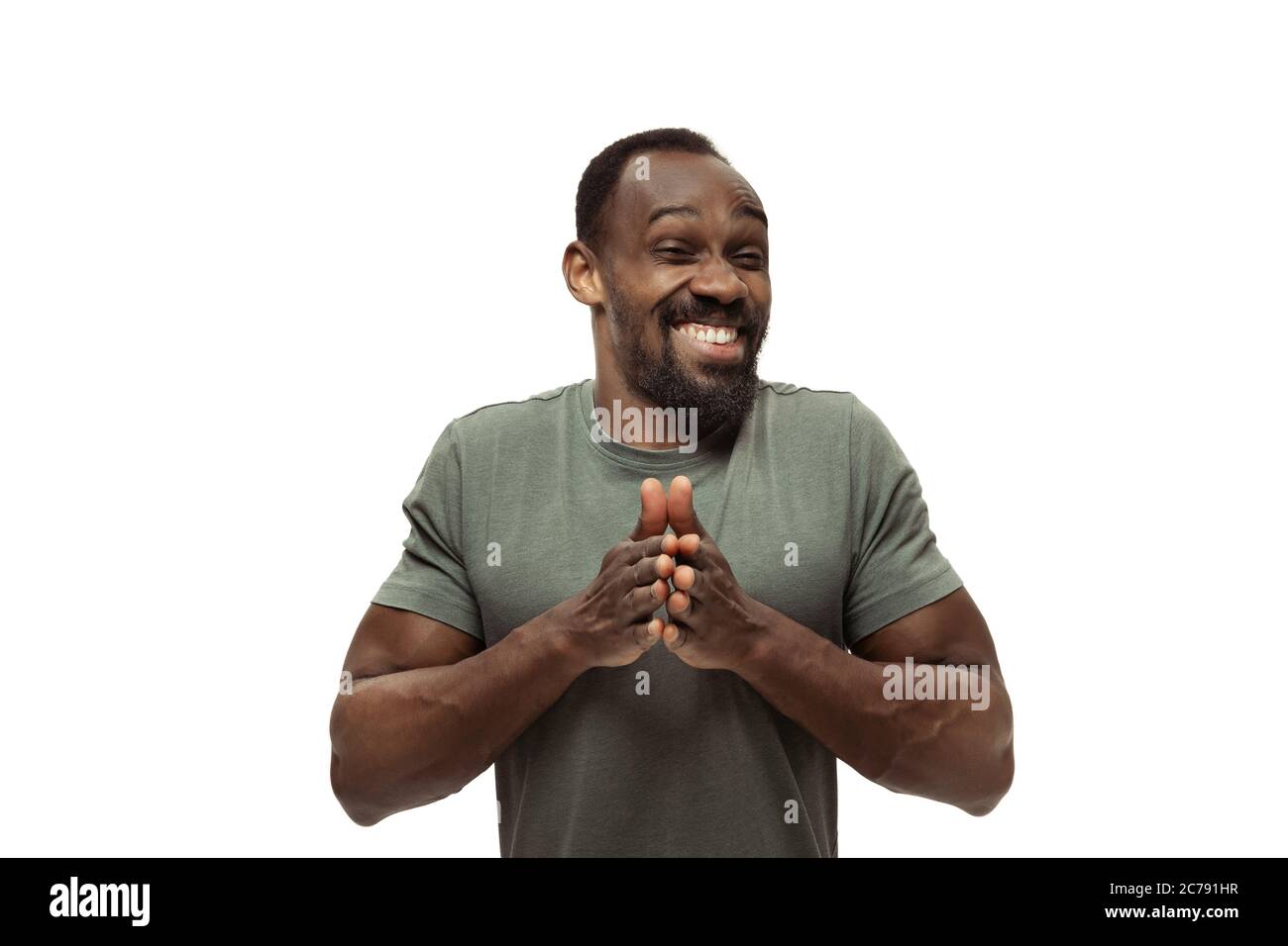 Gloating. Young african-american man with funny, unusual popular ...