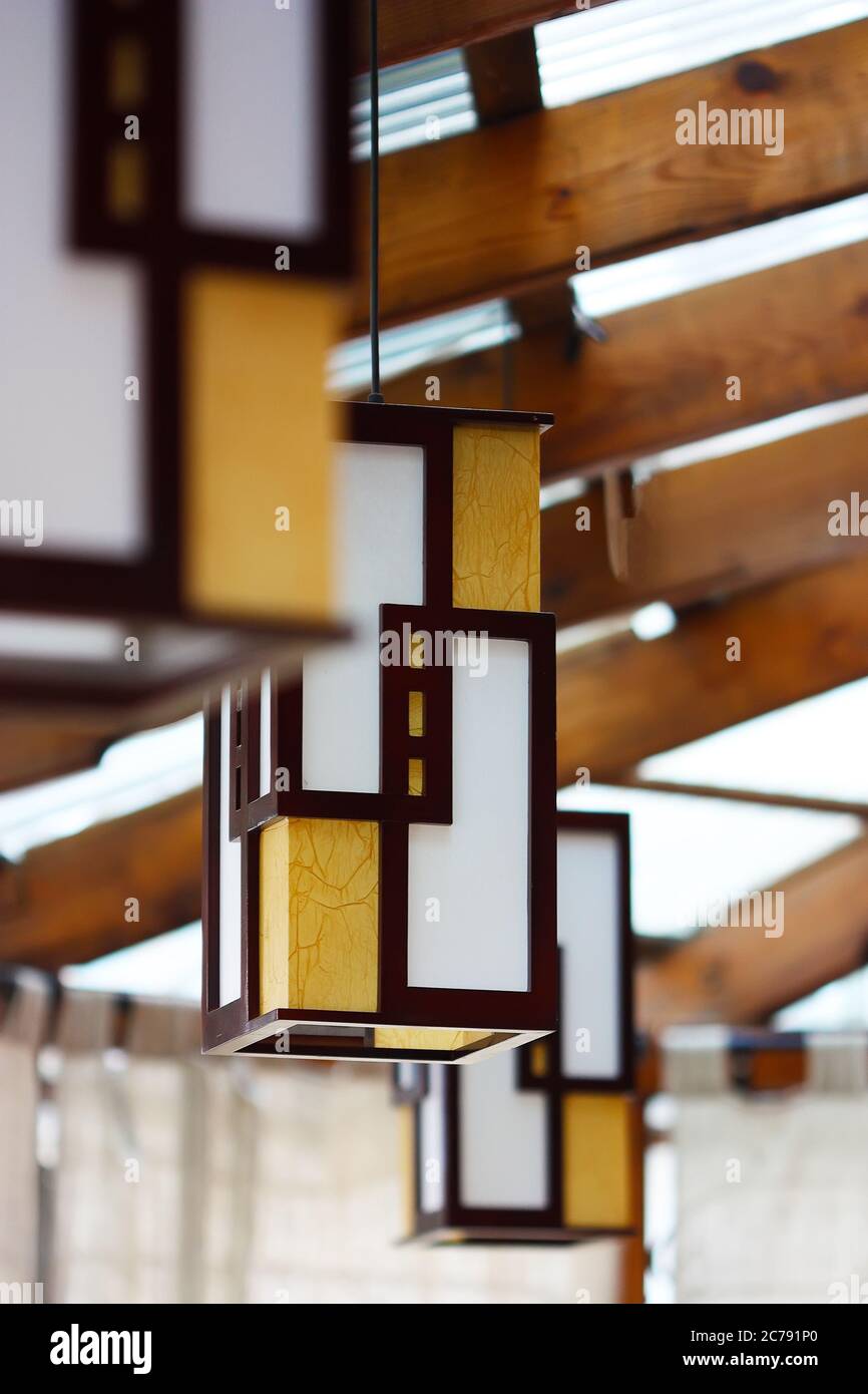 Modern hanging lamp in hotel. Square design Stock Photo - Alamy
