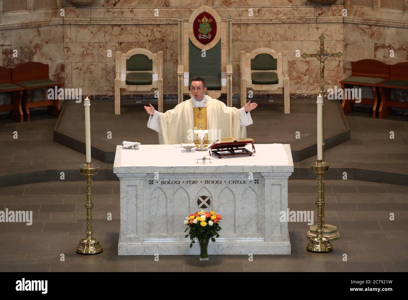 Canon Gerald Sharkey speaks during the first mass at St Andrew's ...