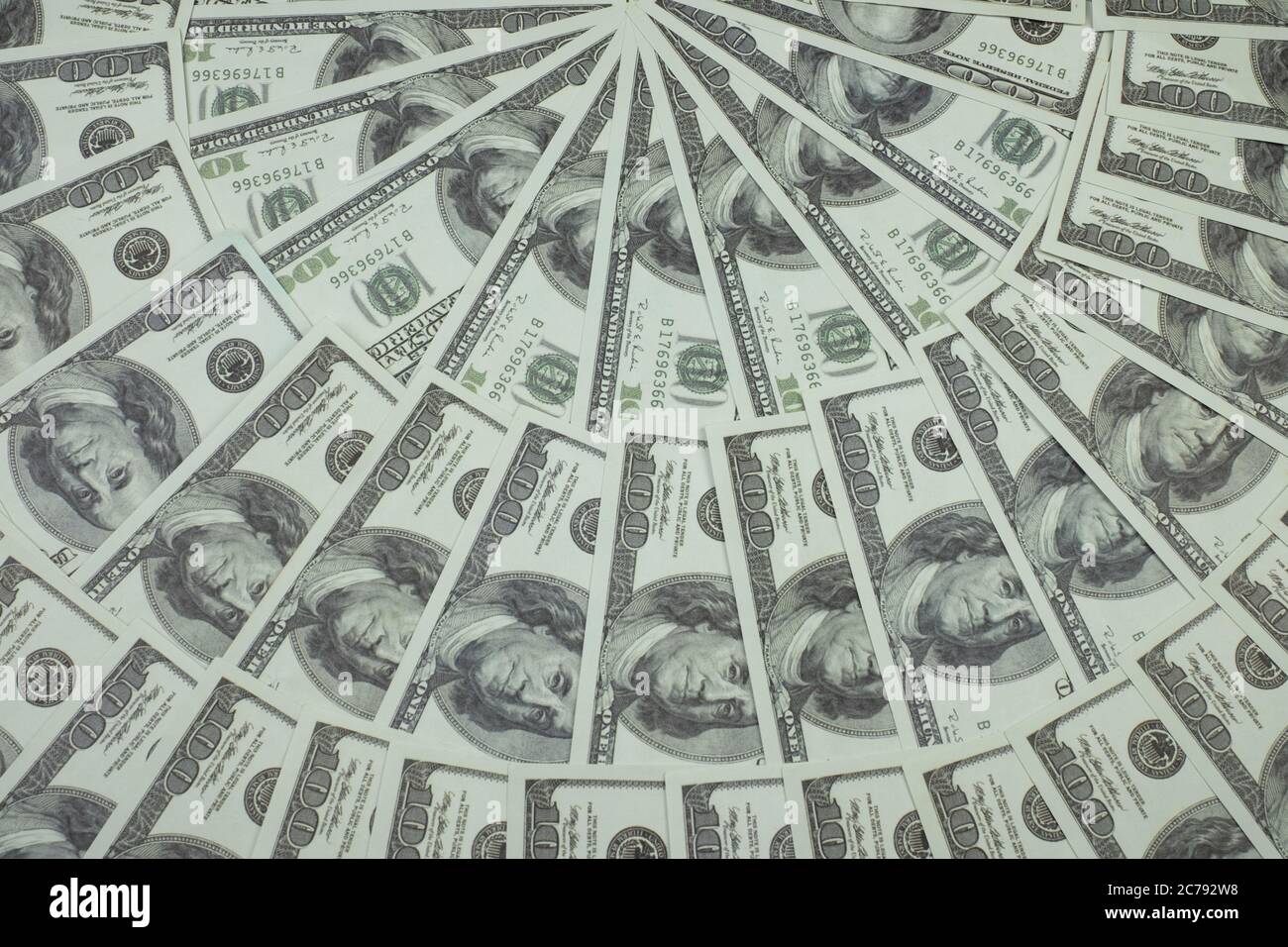 Group of money stack of 100 US dollars banknotes a lot of is arranged ...