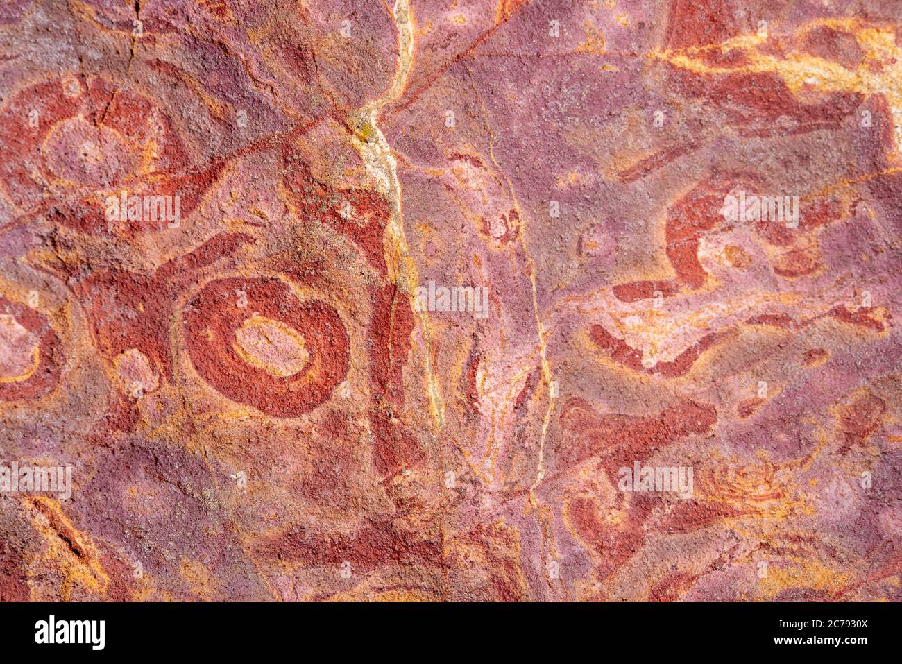 Colorful sand and sedimentary rocks, creating abstract patterns on the ...