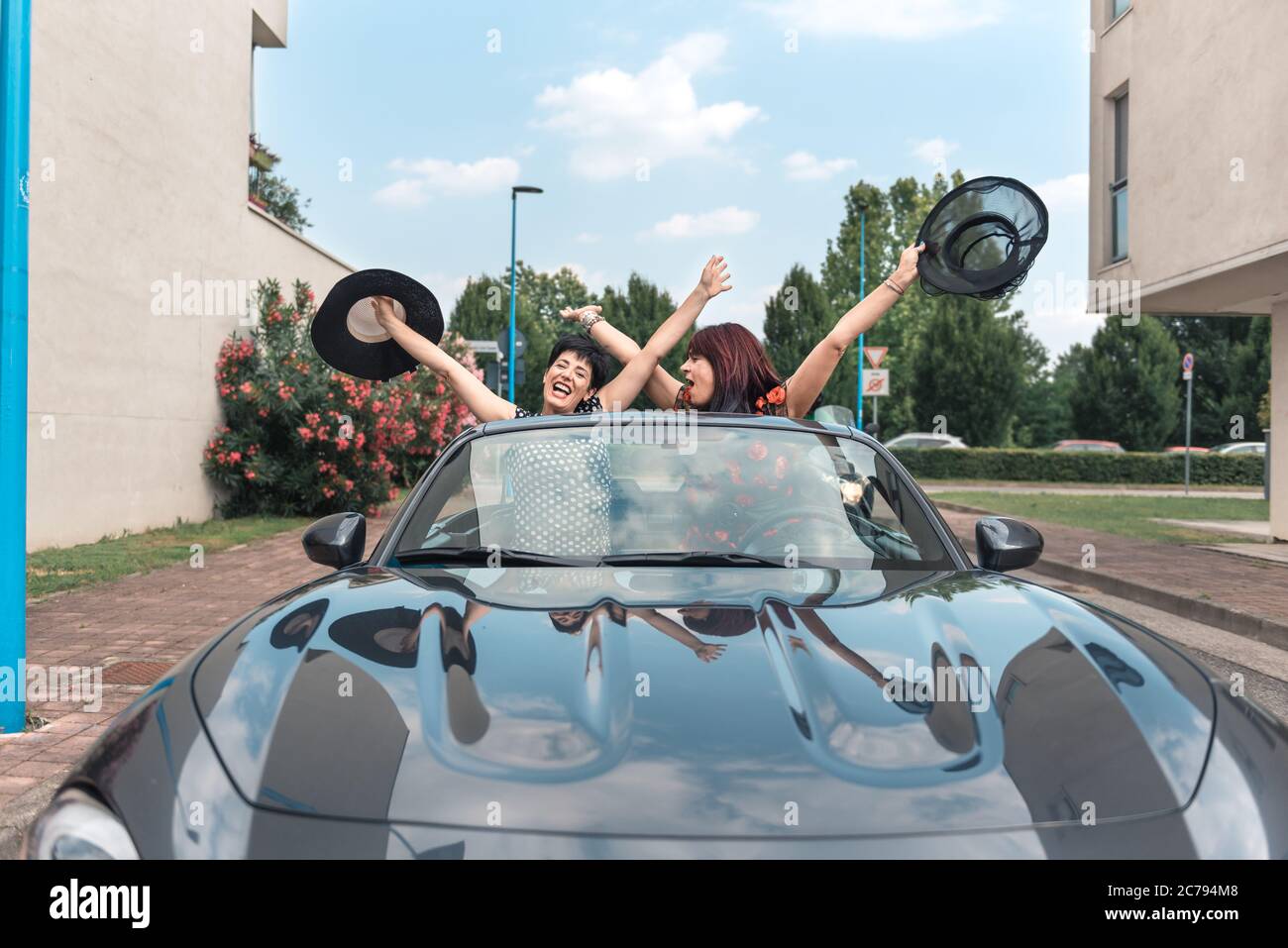 Two female friends on road trip sunset hi-res stock photography and ...