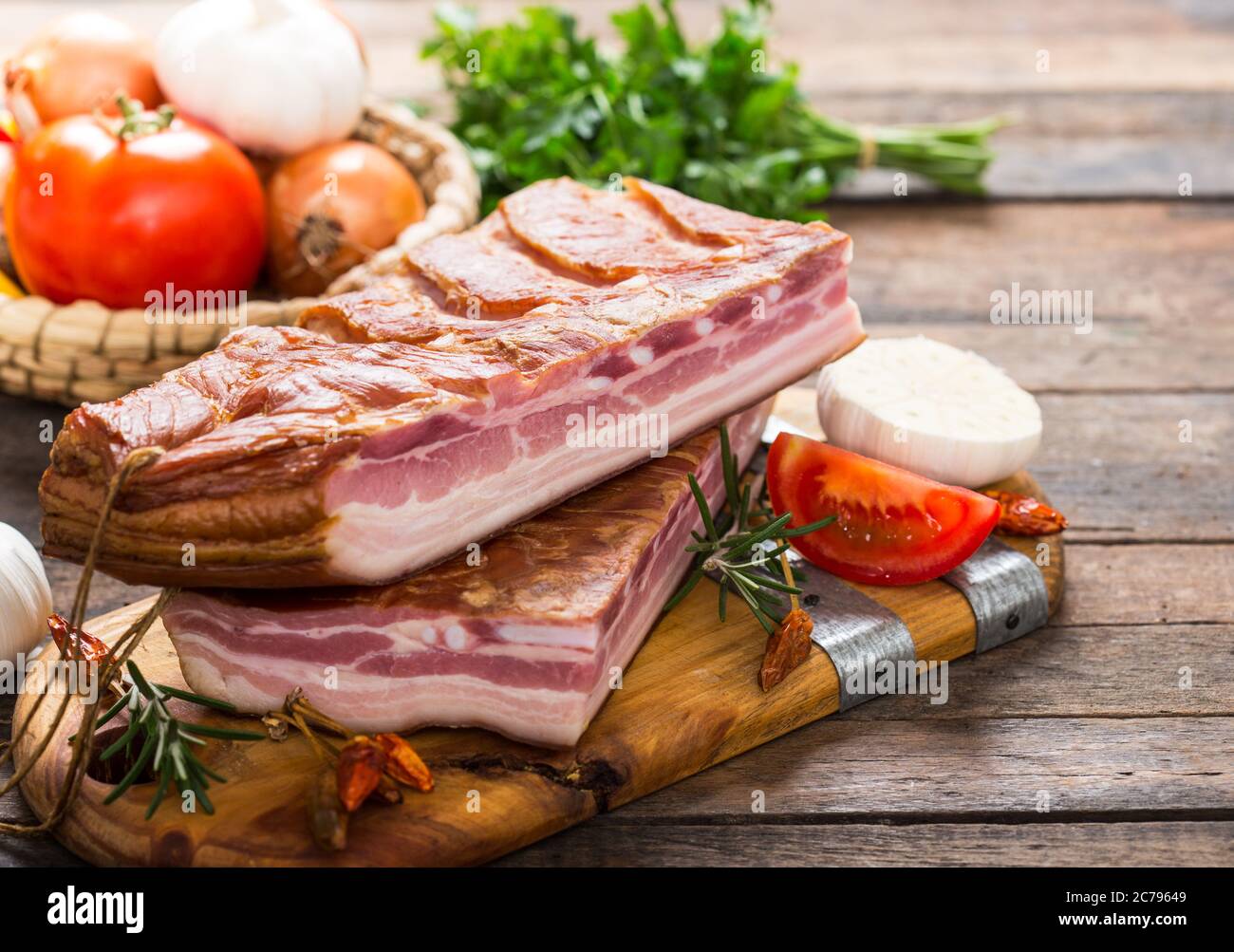 Homemade smoked bacon on wooden board Stock Photo - Alamy
