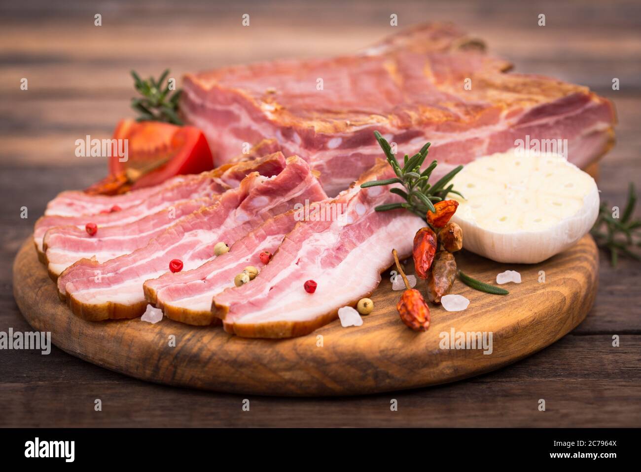 Homemade smoked bacon on wooden board Stock Photo - Alamy