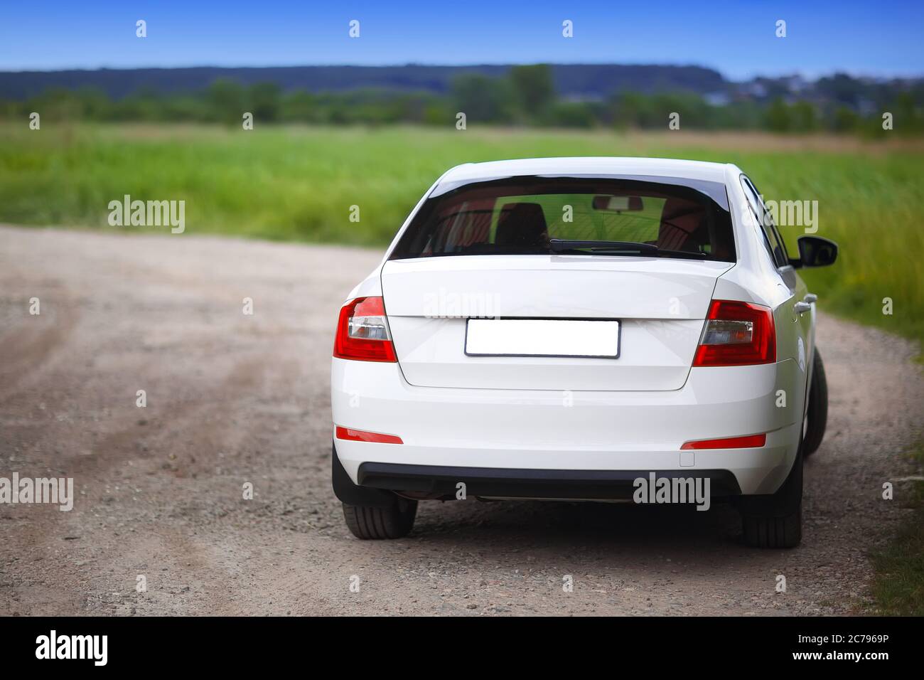 Rear-side view of a car on nature background Stock Photo - Alamy