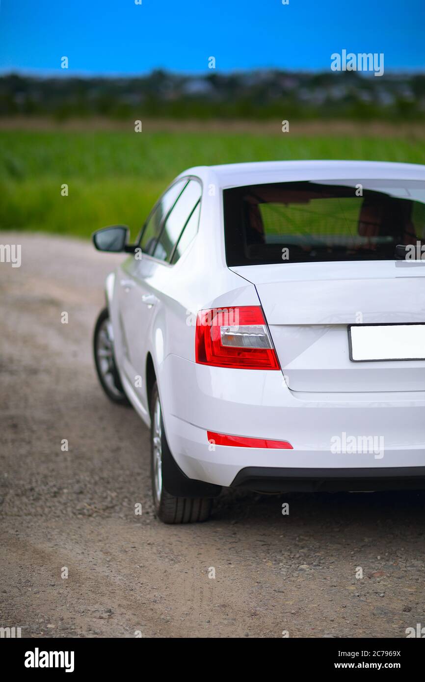 Rear-side view of a car on nature background Stock Photo - Alamy