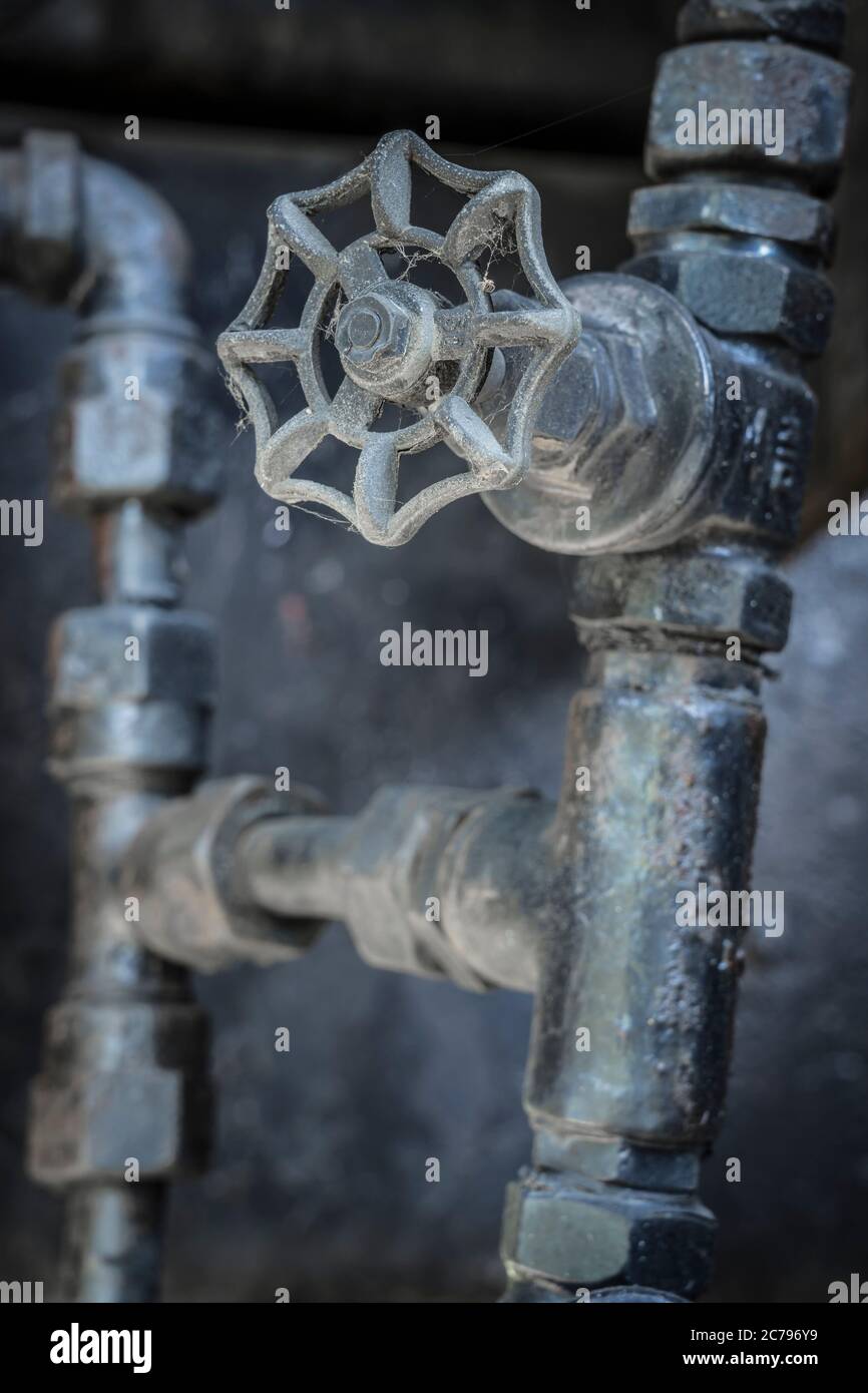 old water tap on a industrial machine Stock Photo - Alamy