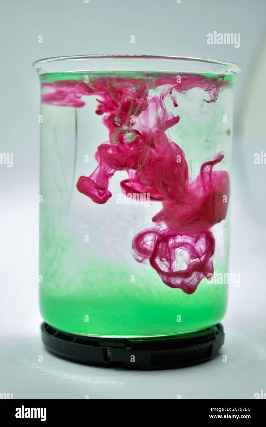 A closeup photograph of Pink and Green color mixed in water Stock Photo ...