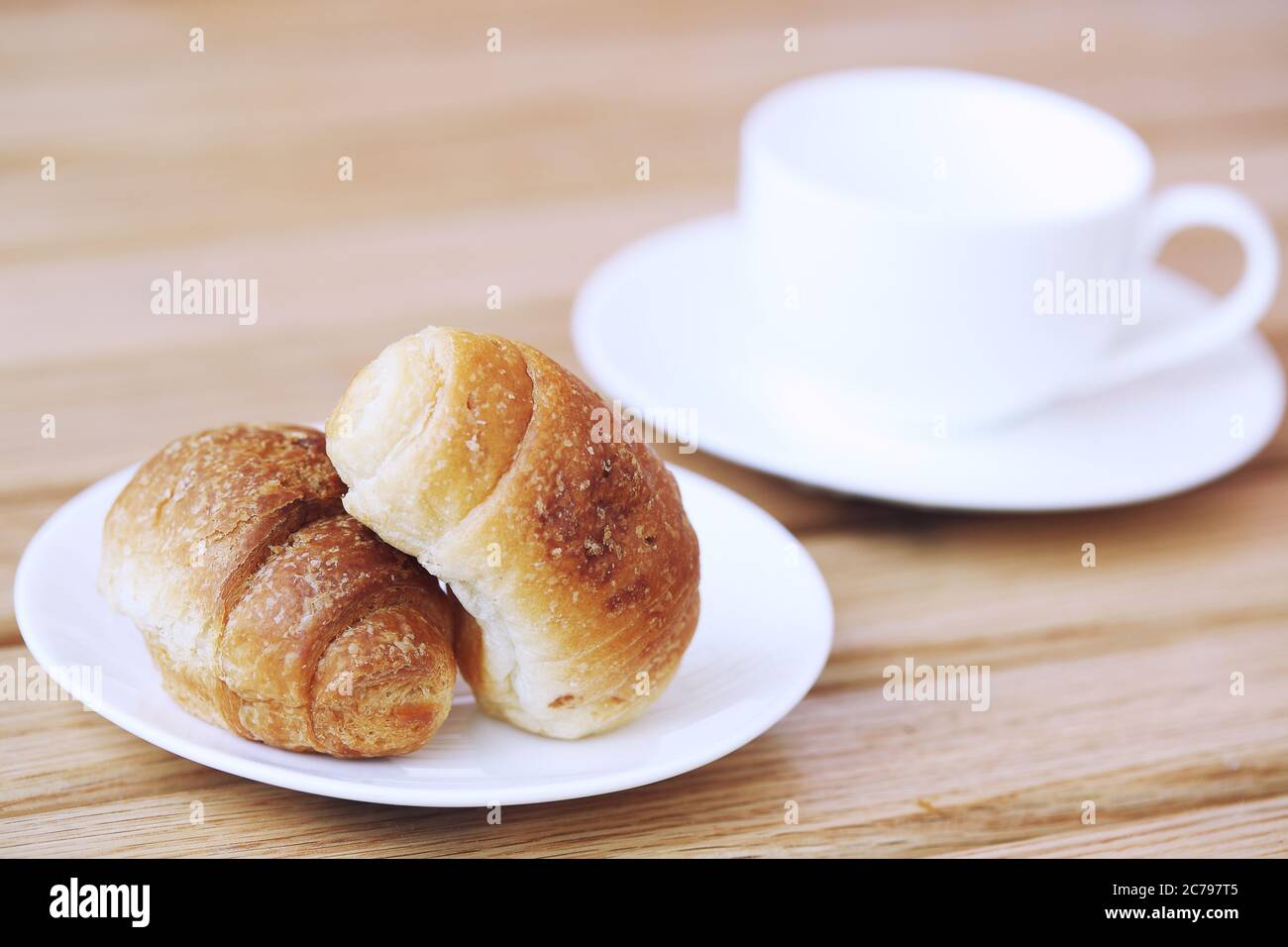 Homemade croissant . Delicious fresh croissant on wood table. Selective focus Stock Photo - Alamy