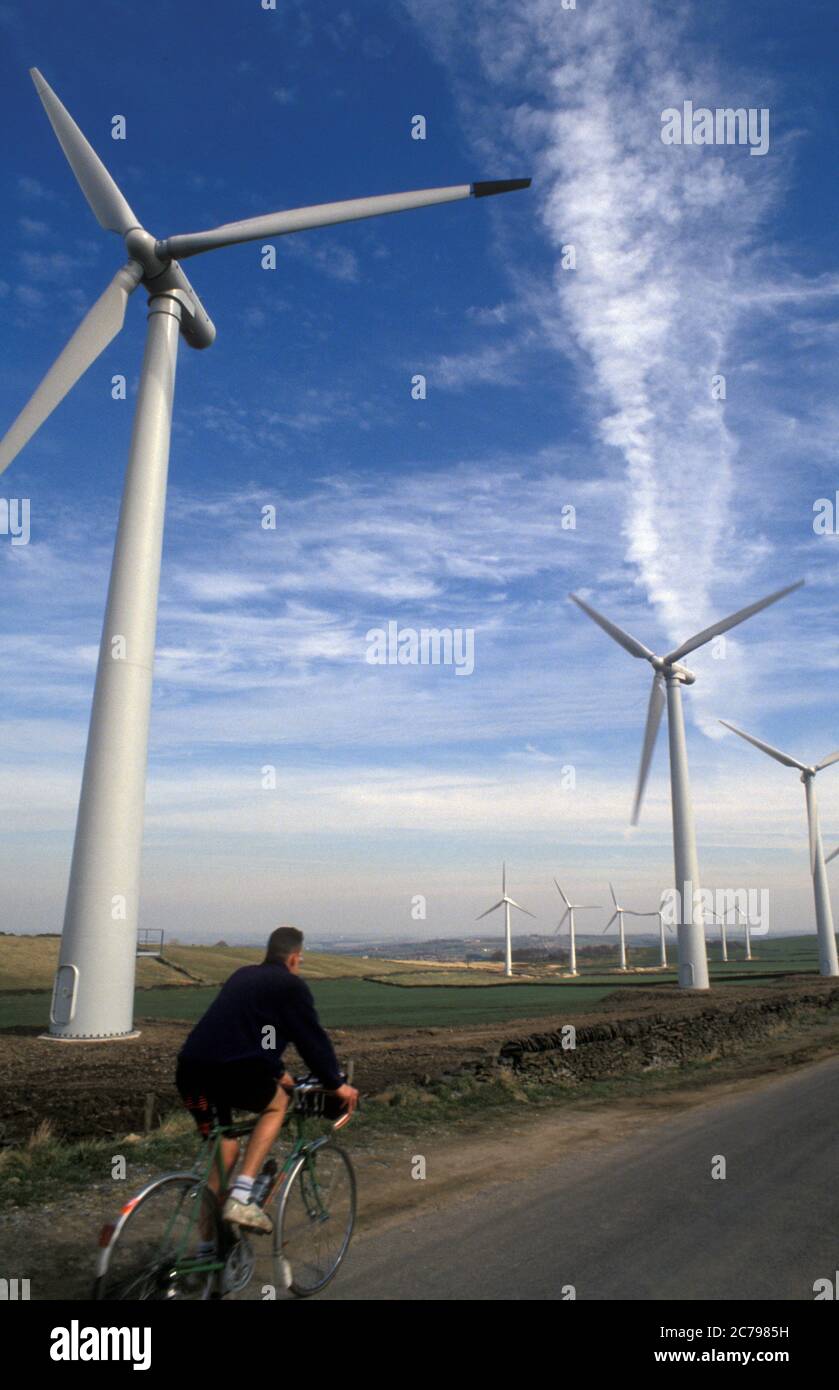 Cyclist passing wind turbines South Yorkshire UK Stock Photo - Alamy
