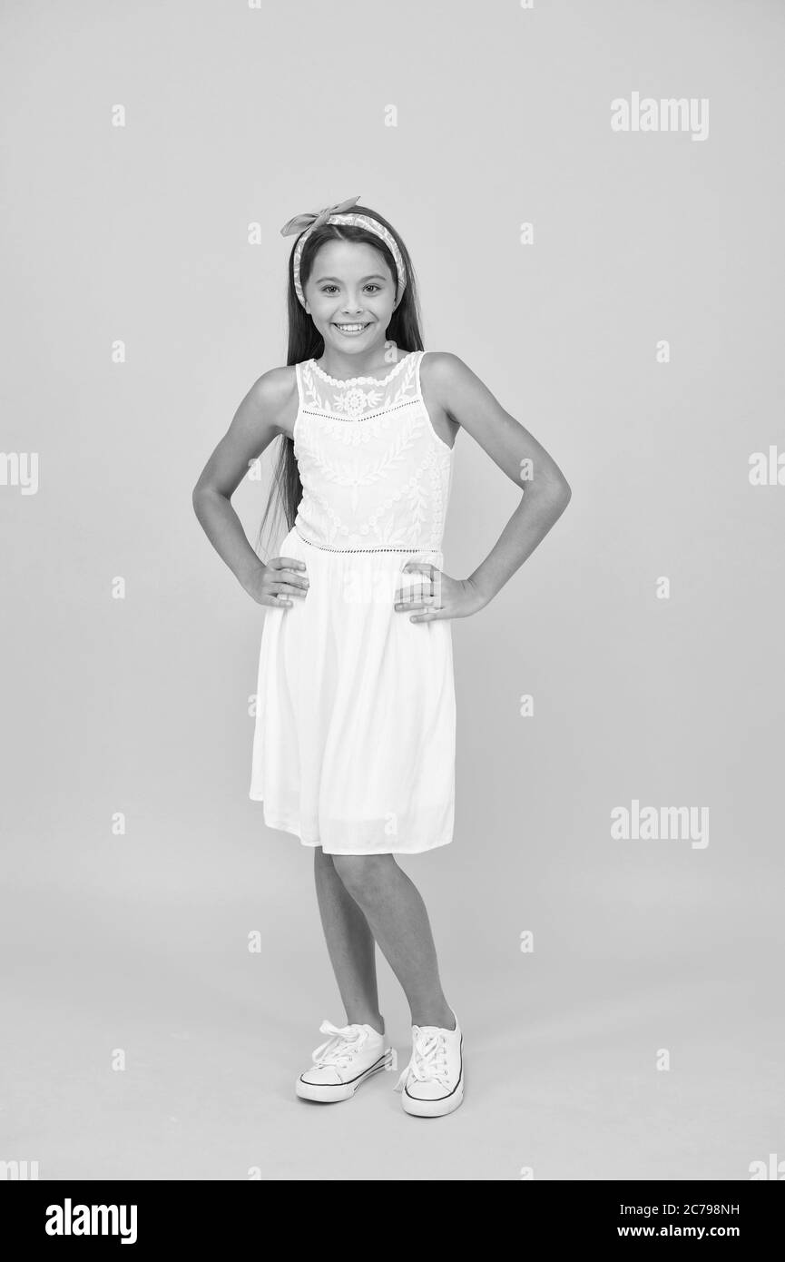 Keeping up with fashion trends. Fashion little model yellow background ...