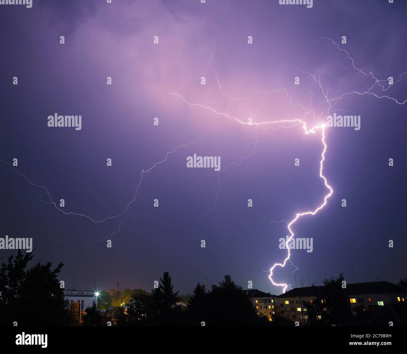 Lightning over the city. Powerfull flash at night Stock Photo - Alamy