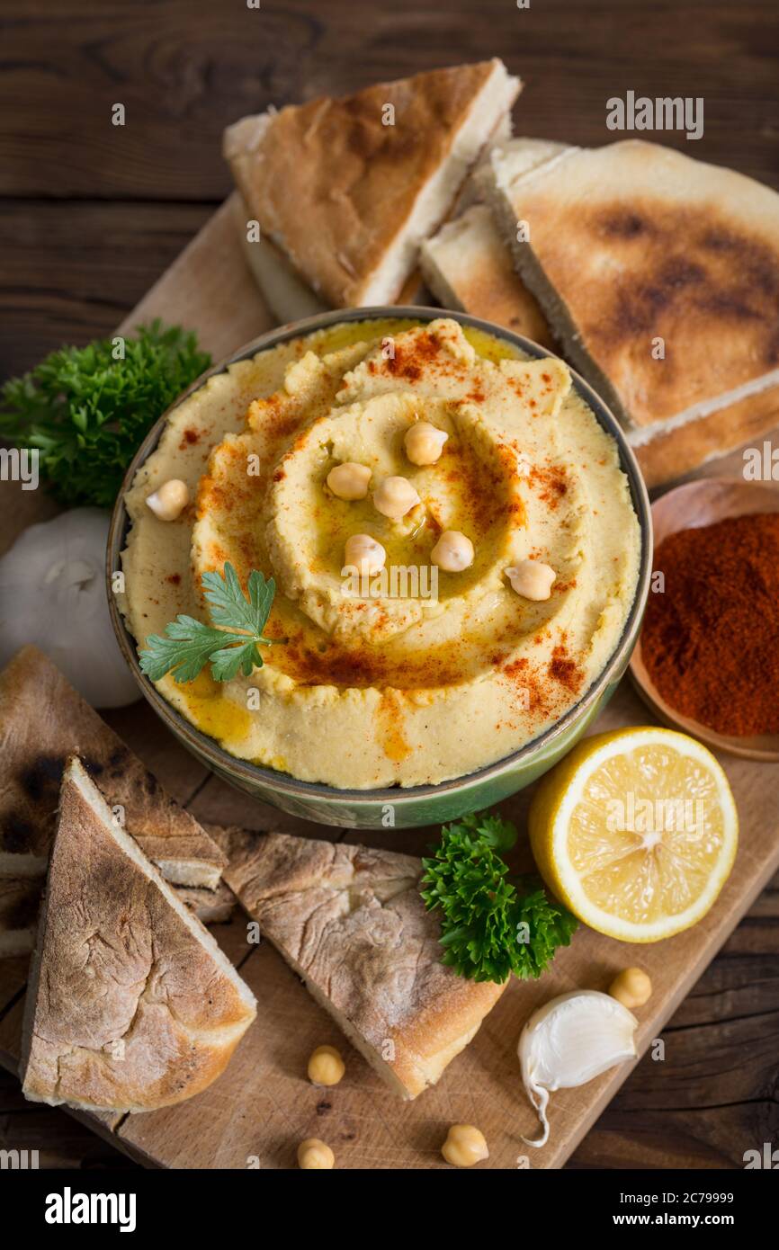 Homemade chickpea hummus with olive oil Stock Photo - Alamy
