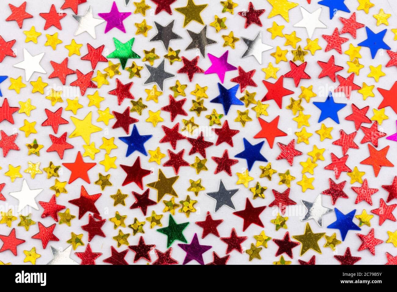 festive background with a pattern of multicolored stars Stock Photo - Alamy