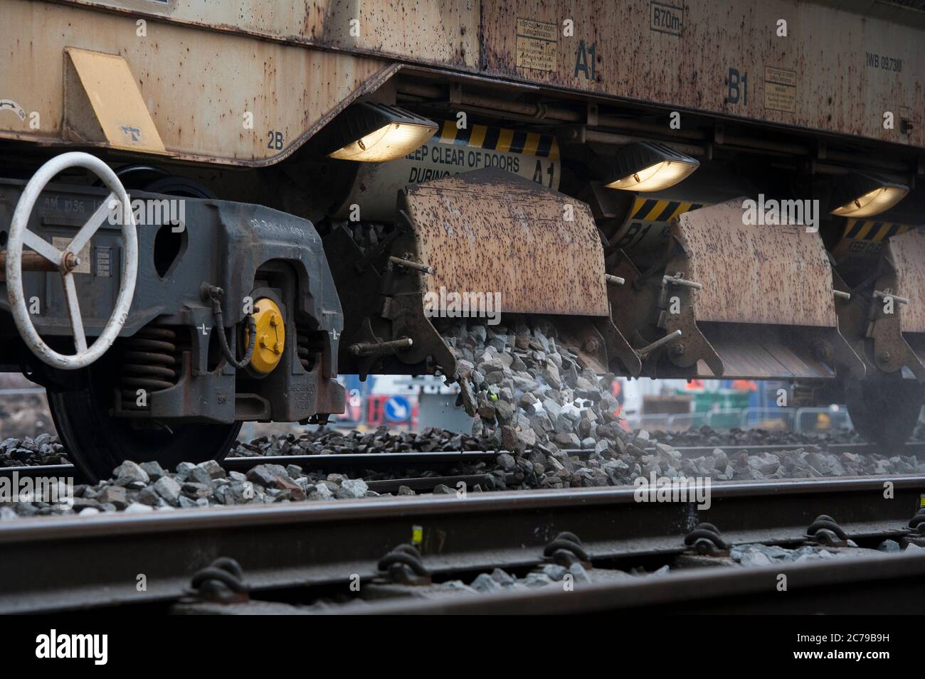 Network Rail train laying new ballast on track on a stretch of railway ...