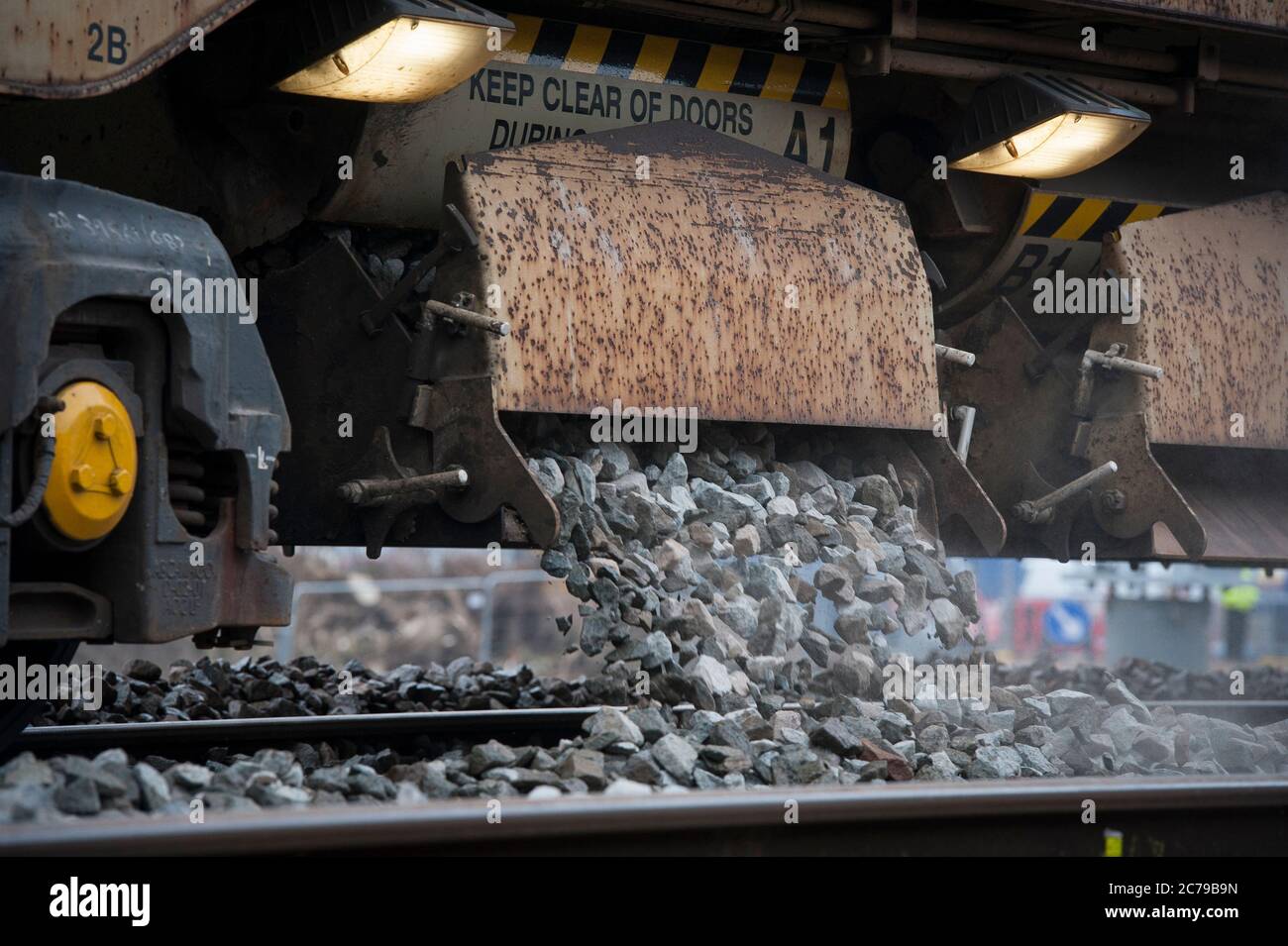 Network Rail train laying new ballast on track on a stretch of railway ...