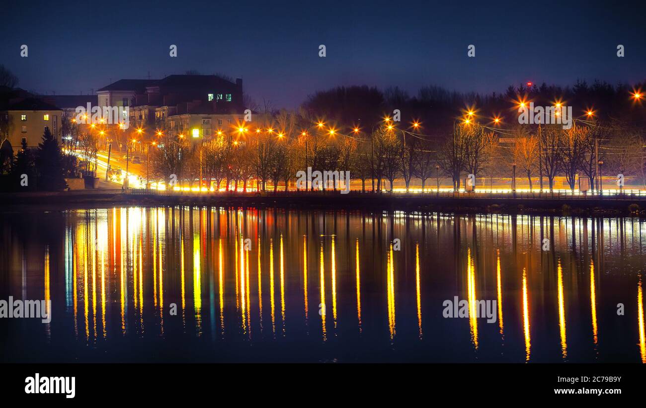 Panorama night city lights. Colourfull reflection in water Stock Photo ...