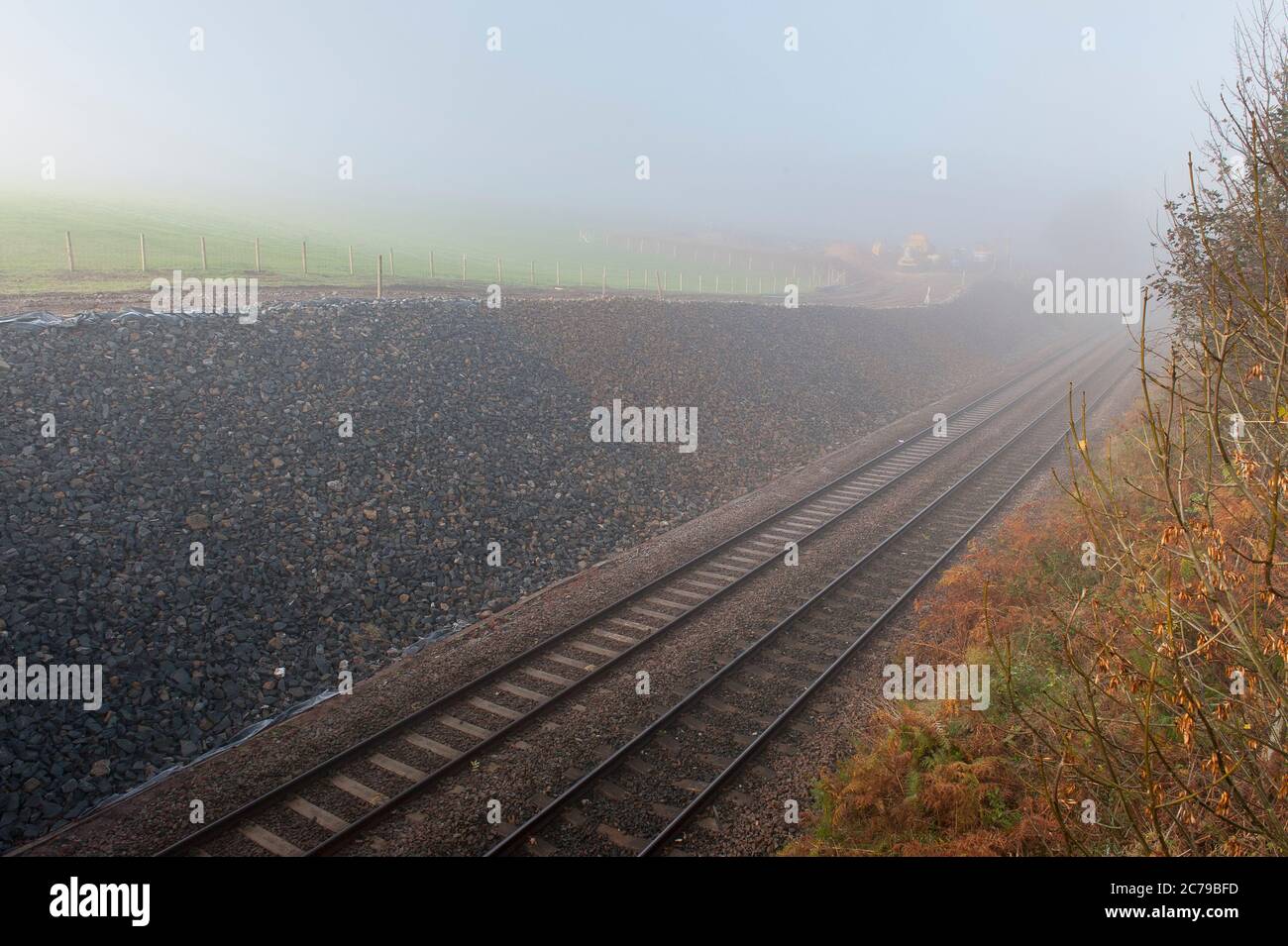 Rail track in a cutting on a misty day in England, UK Stock Photo - Alamy