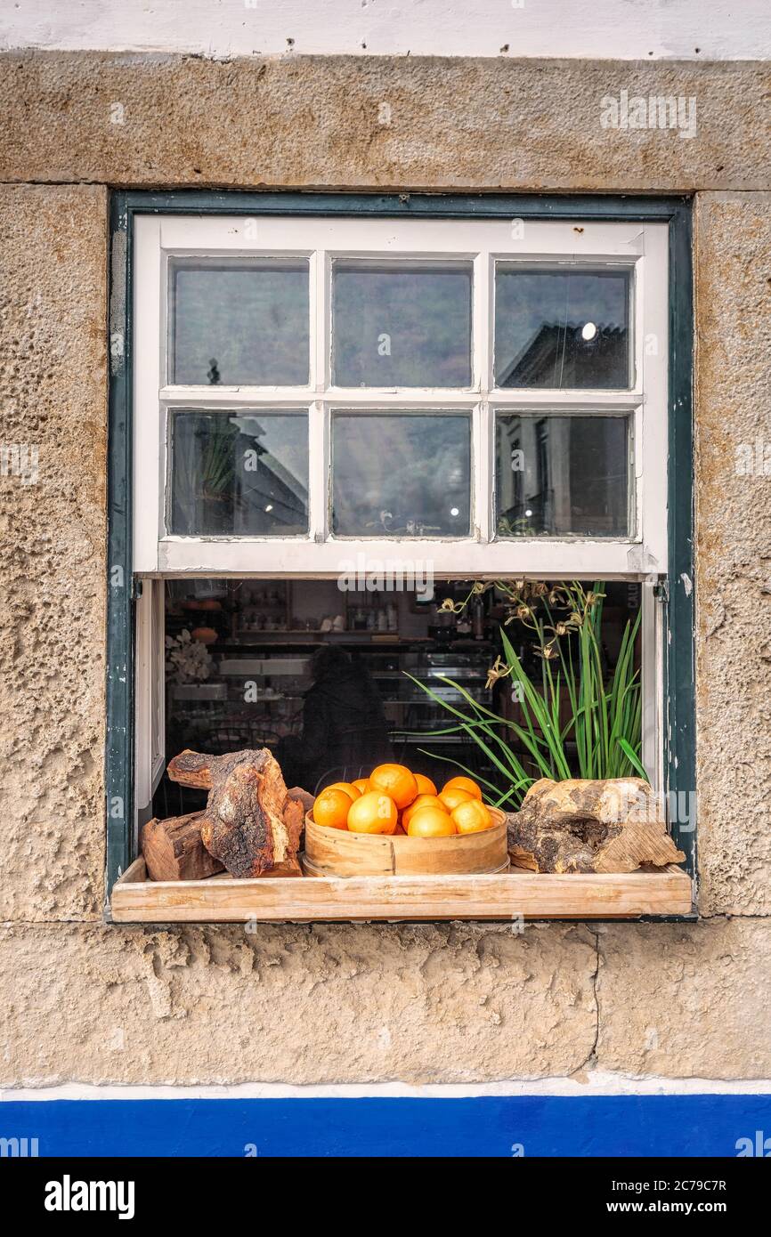Colorful wooden window in the facade of a typical Portuguese house at ...