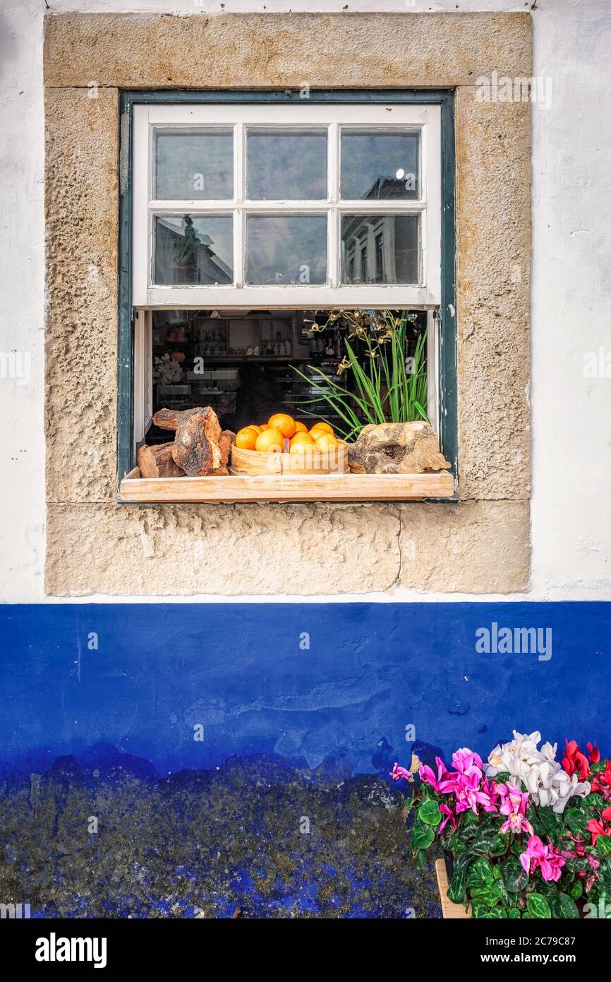 Colorful wooden window in the facade of a typical Portuguese house at ...