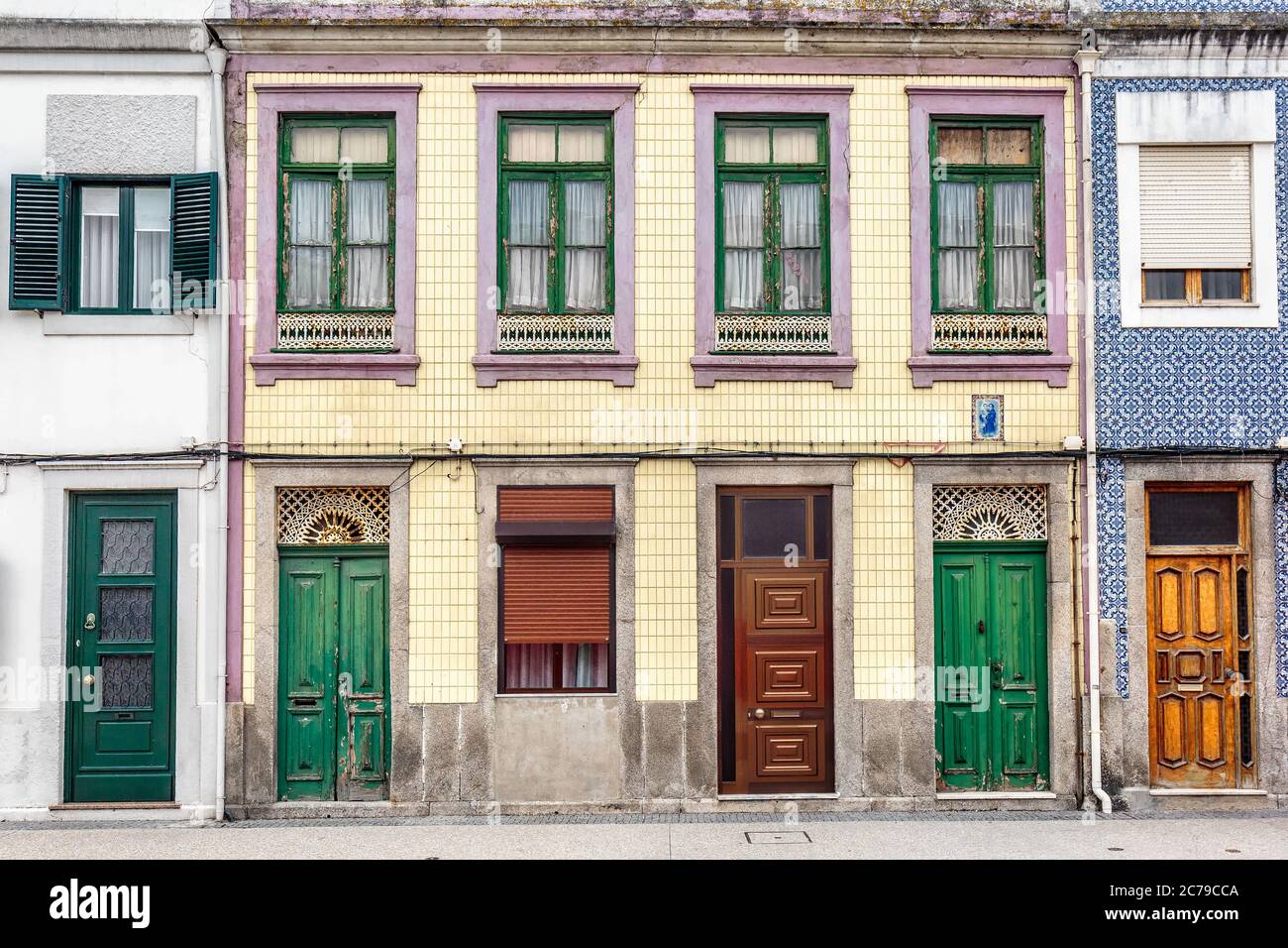 Colorful wooden door in the facade of a typical Portuguese house at ...