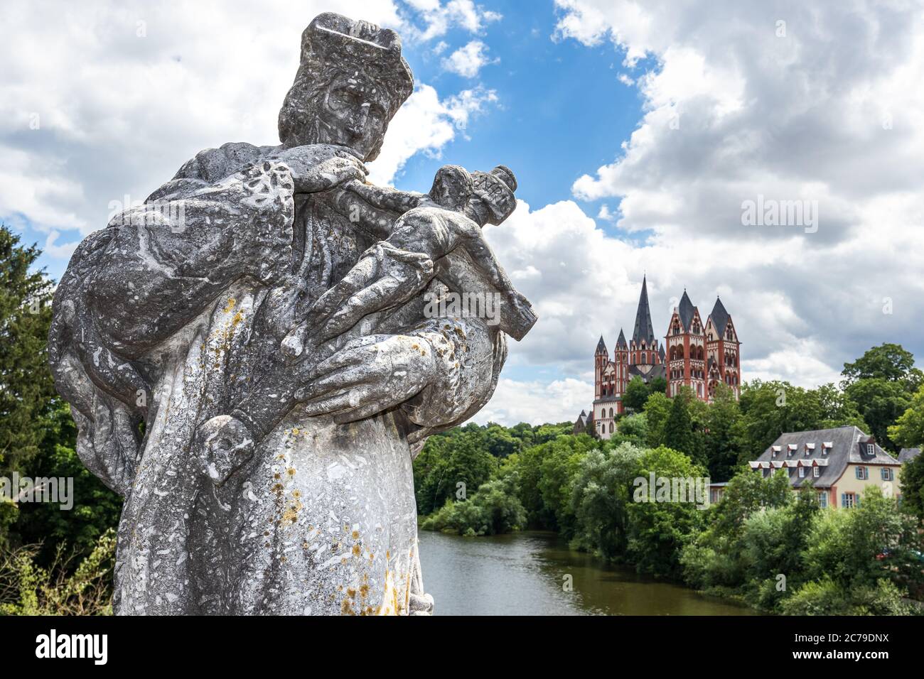 Statue of St. John of Nepomuk on Old Lahn Bridge over river Lahn, in ...