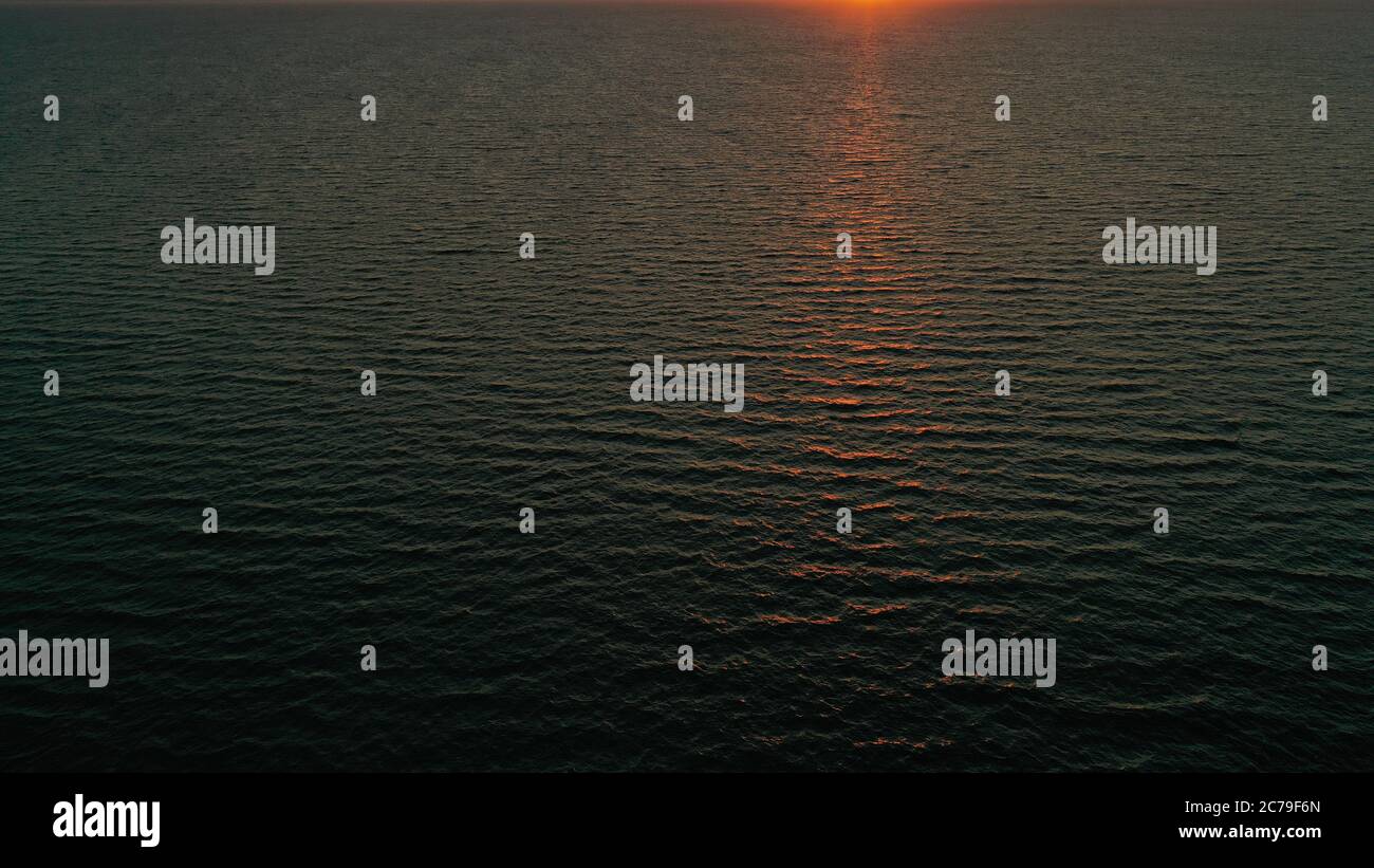 wave texture. Silhouette view. sea waves before sunrise. ray of the sun ...