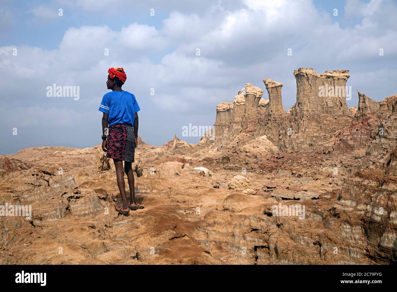 Black man of the Afar tribe and towers and pinnacles composed of salt ...