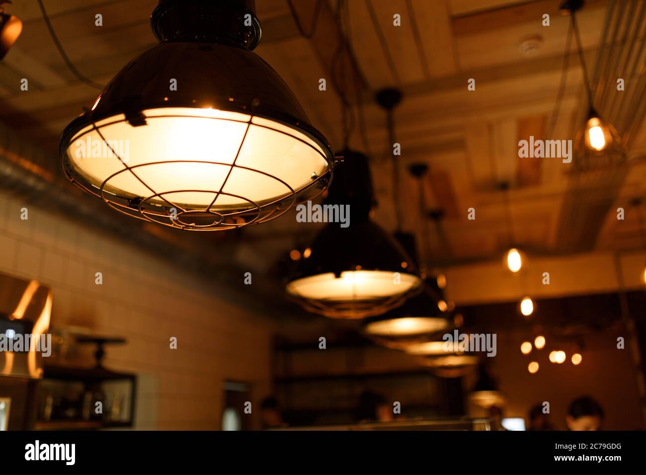 Stylish lighting lamps over a bar counter in a loft hookah bar Stock ...