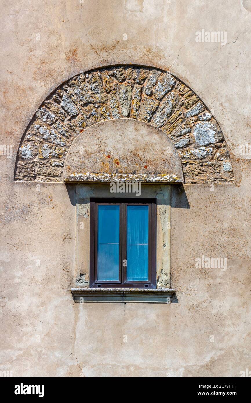 Architecture of an ancient arched upper window in Tuscany Stock Photo ...