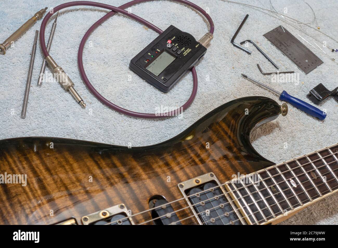 Luthier workbench with tools and an eletric guitar Stock Photo - Alamy