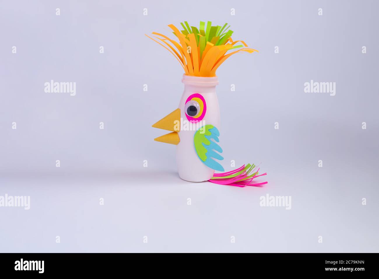 simple parrot craft for kids, colorful creative bird, reused yogurt ...