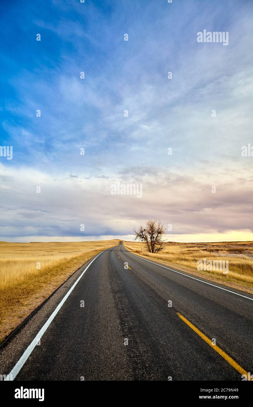Scenic road in Badlands National Park at sunset, travel concept, USA ...