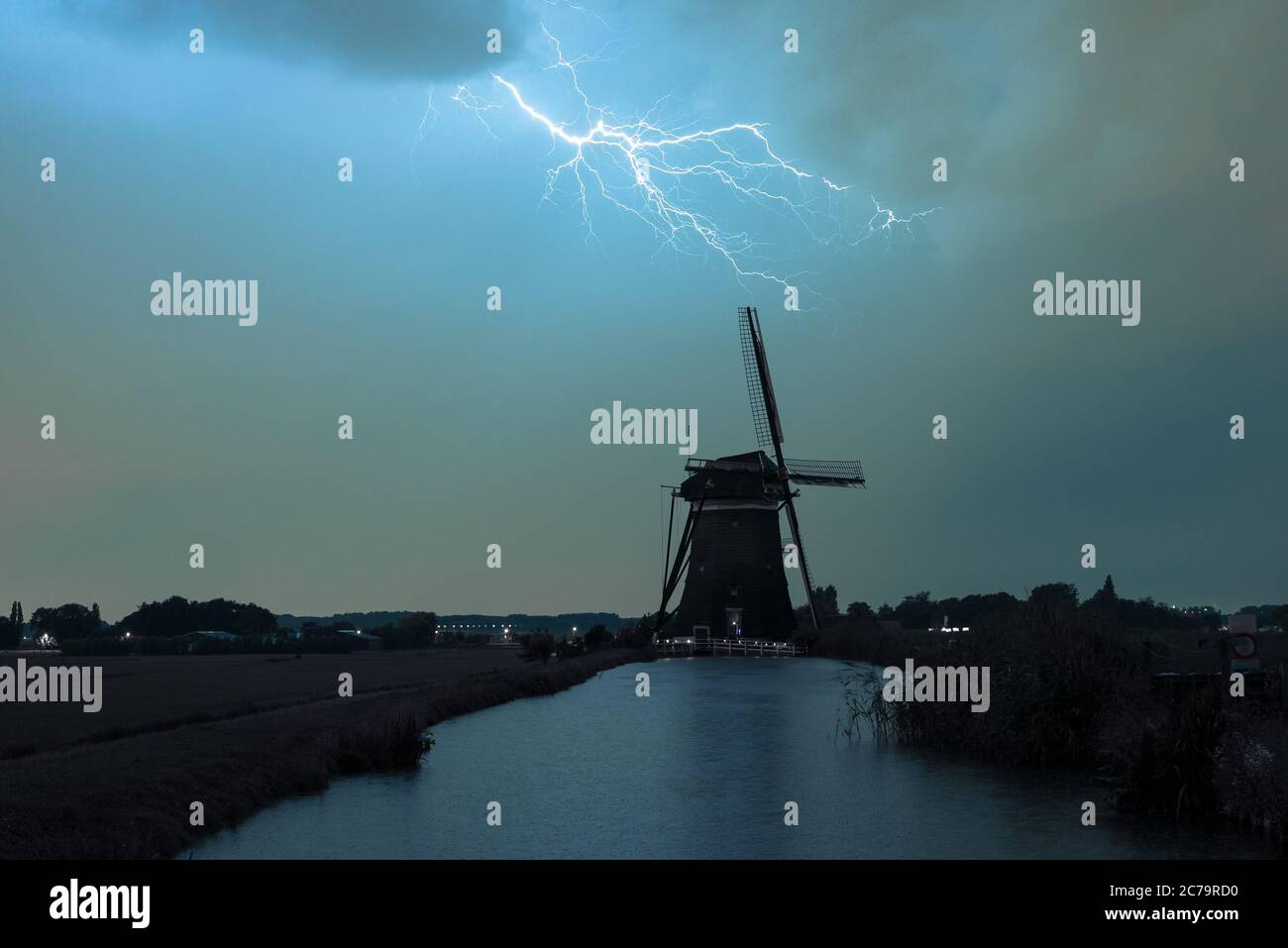 Dutch windmill in stormy weather with lightning bolt Stock Photo - Alamy