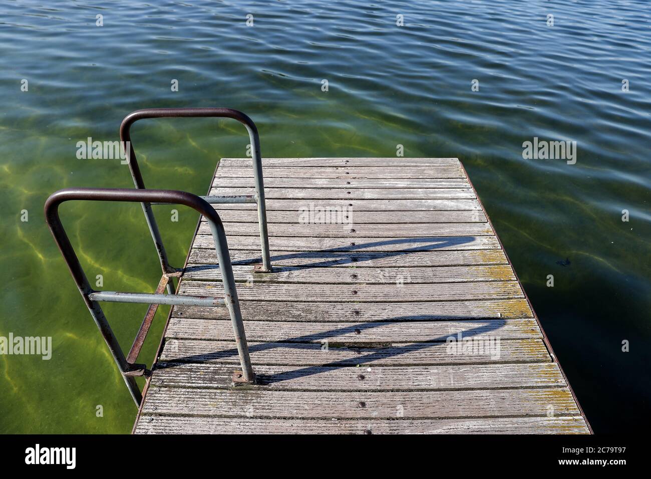 14 July 2020, Saxony-Anhalt, Roßbach: A bathing jetty leads to the ...