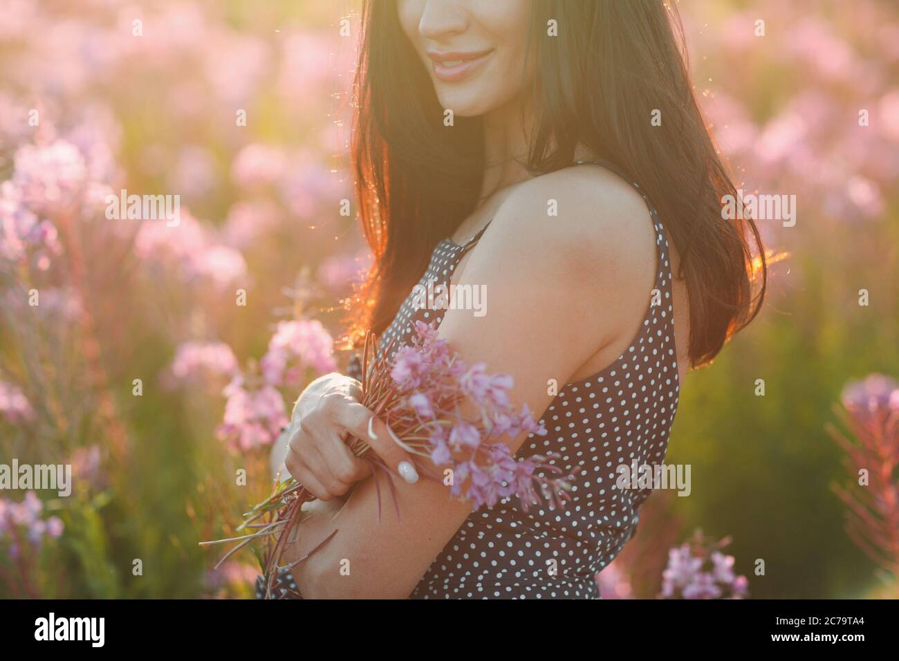 Girl on blooming Sally flower field. Lilac flowers and woman Stock ...