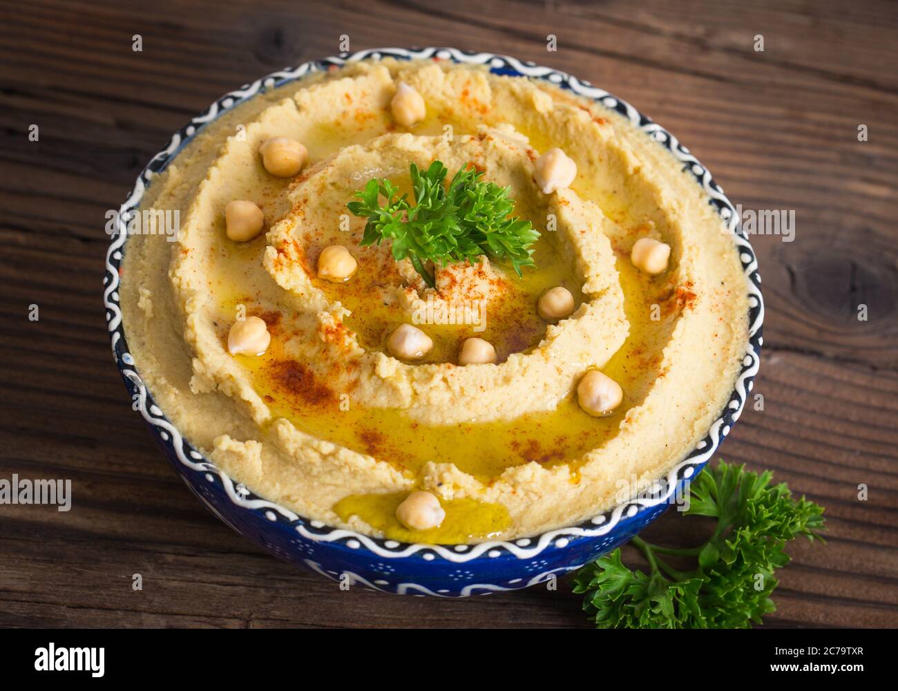 Homemade chickpea hummus with olive oil Stock Photo - Alamy