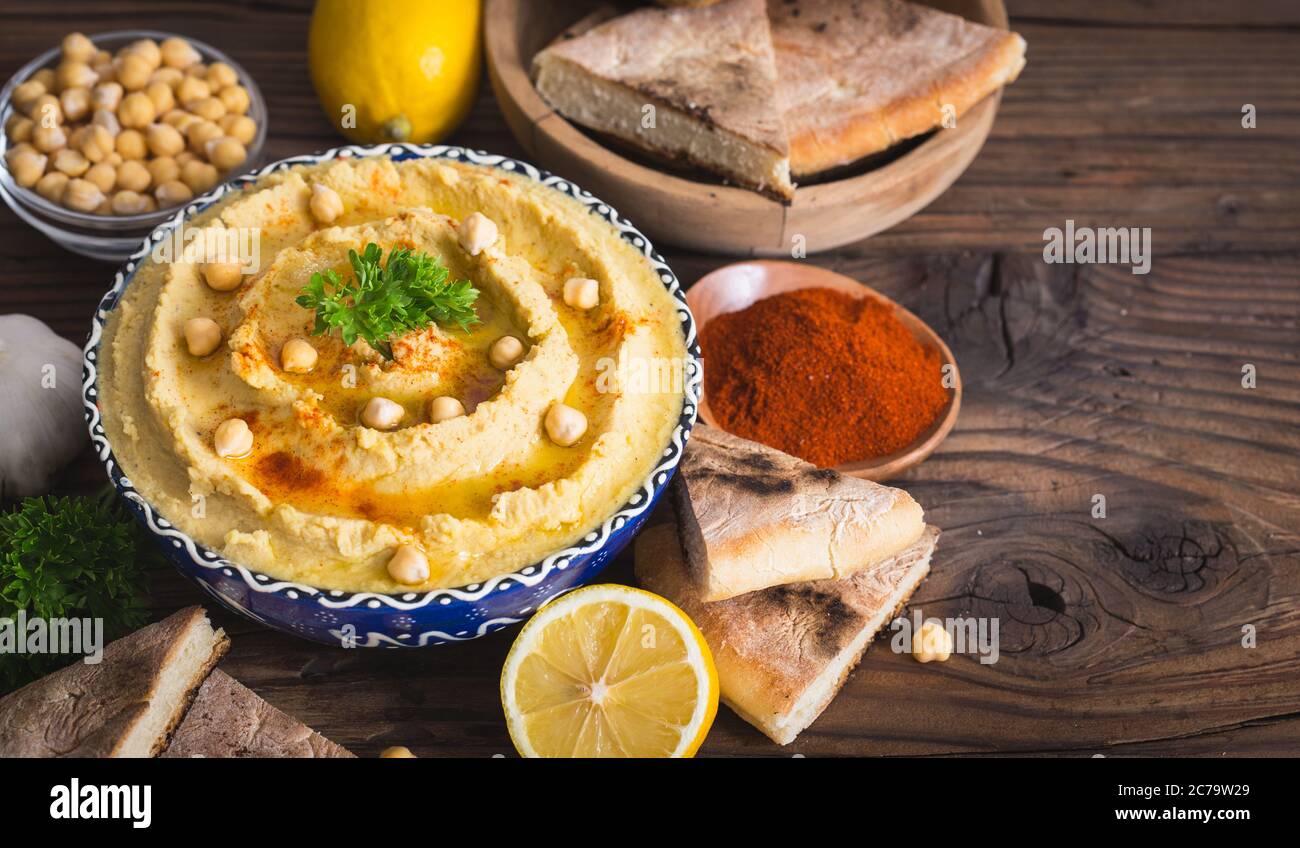 Homemade chickpea hummus with olive oil Stock Photo - Alamy