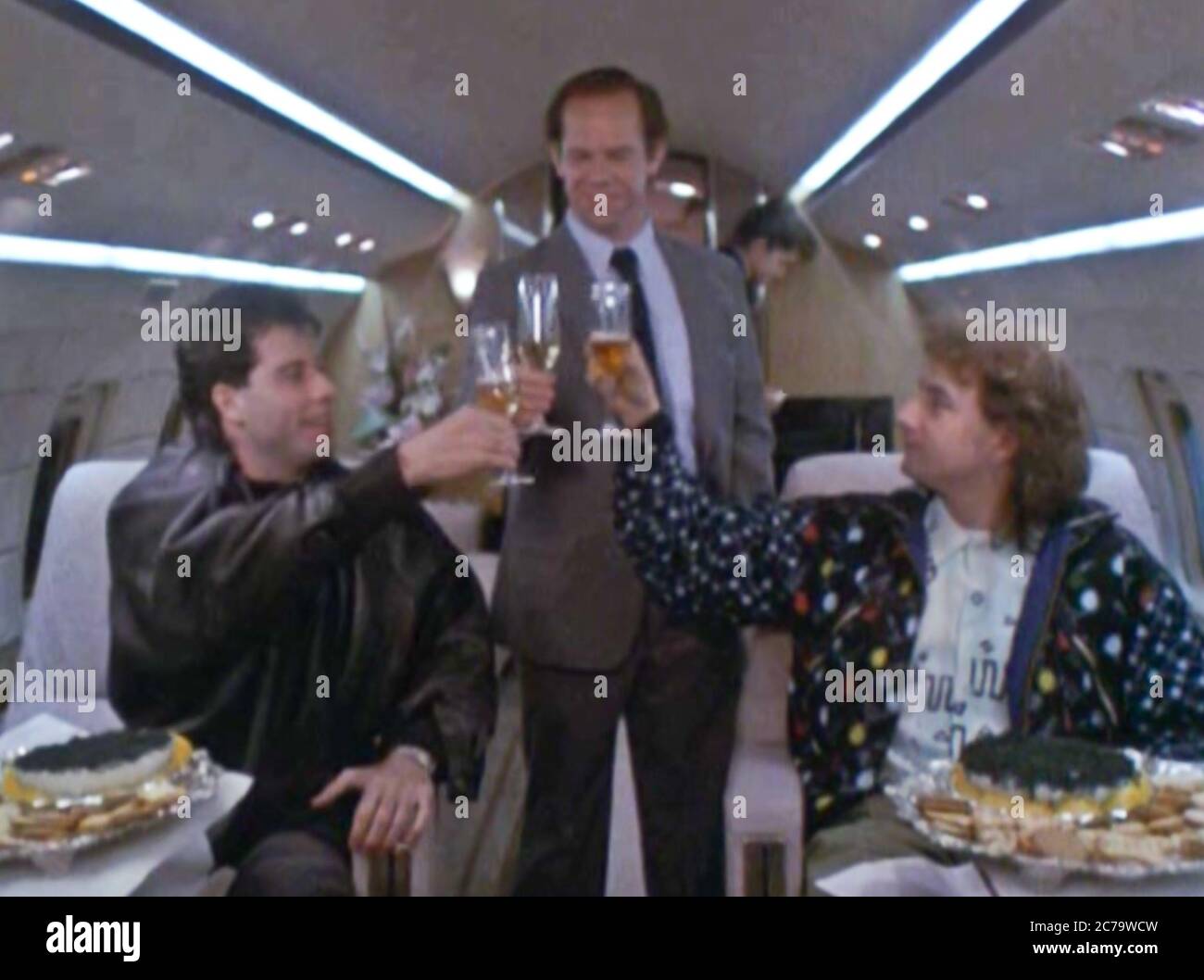 USA. Charles Martin Smith, John Travolta and Arye Gross in a scene from ...