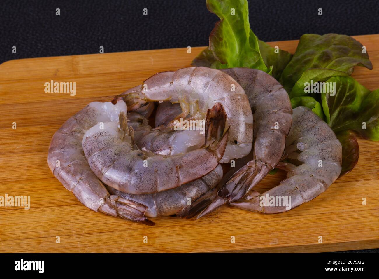 Raw king prawns ready for cooking served salad leaves Stock Photo - Alamy