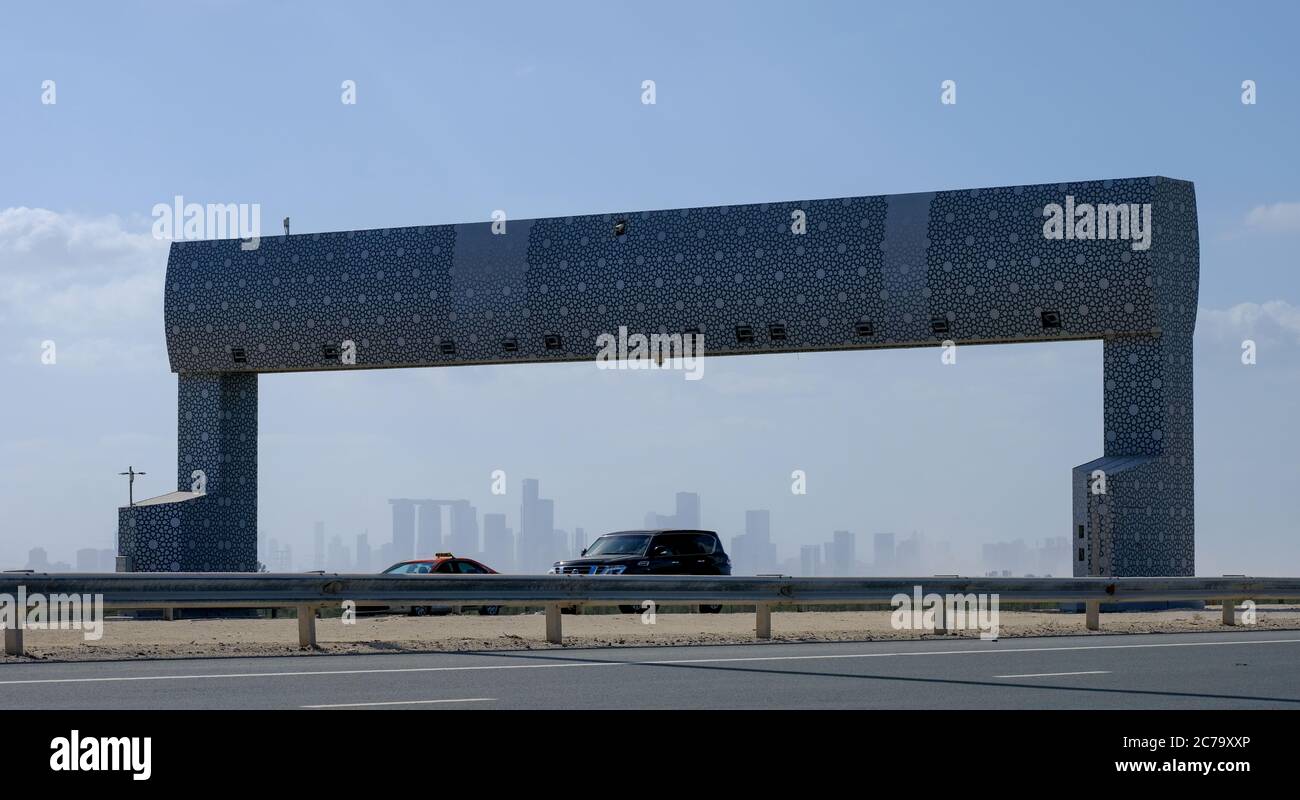 Distant view of Abu Dhabi Cityscape through Toll Bridge on Yas Island ...
